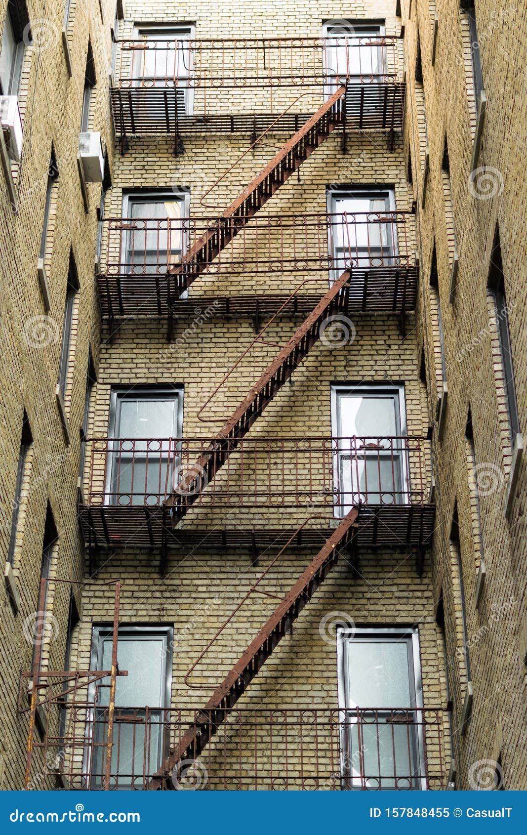 Facade of a Brownstone with Old Rusty Fire Escape Stock Image - Image ...