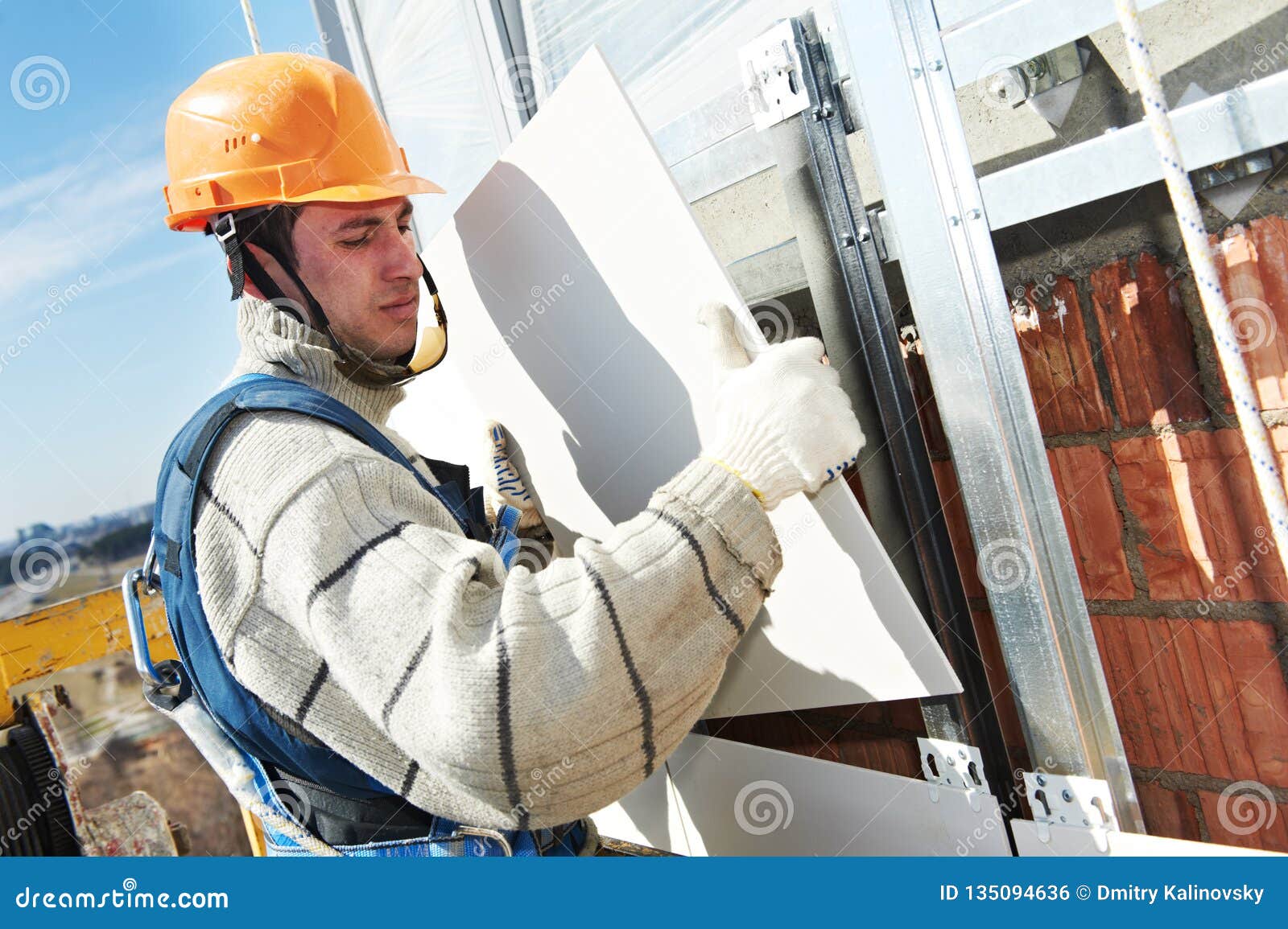 Facade Builder Installing Tile on Wall Stock Photo - Image of building ...