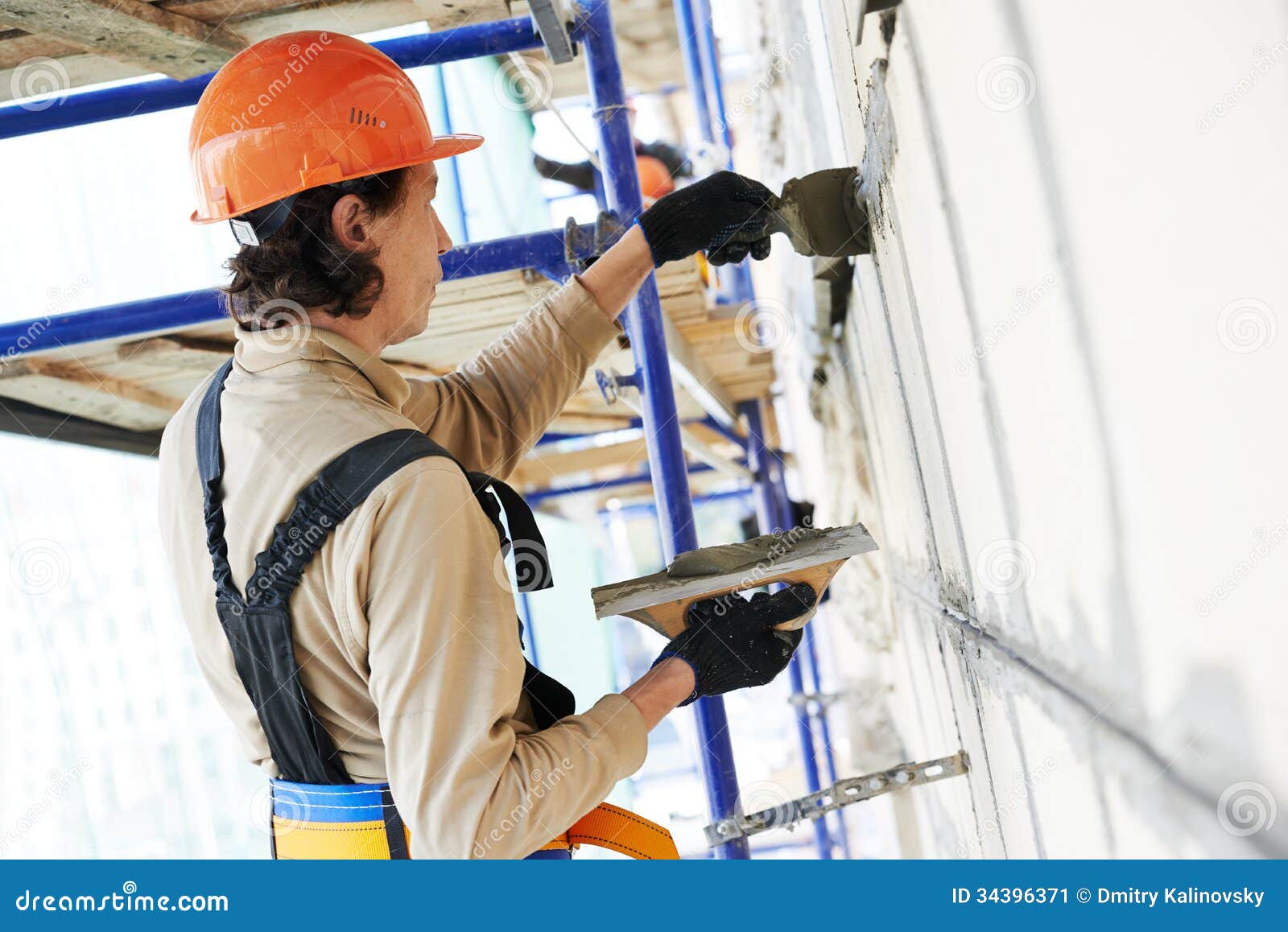 Facade Builder Plasterer At Work Stock Image - Image: 34396371