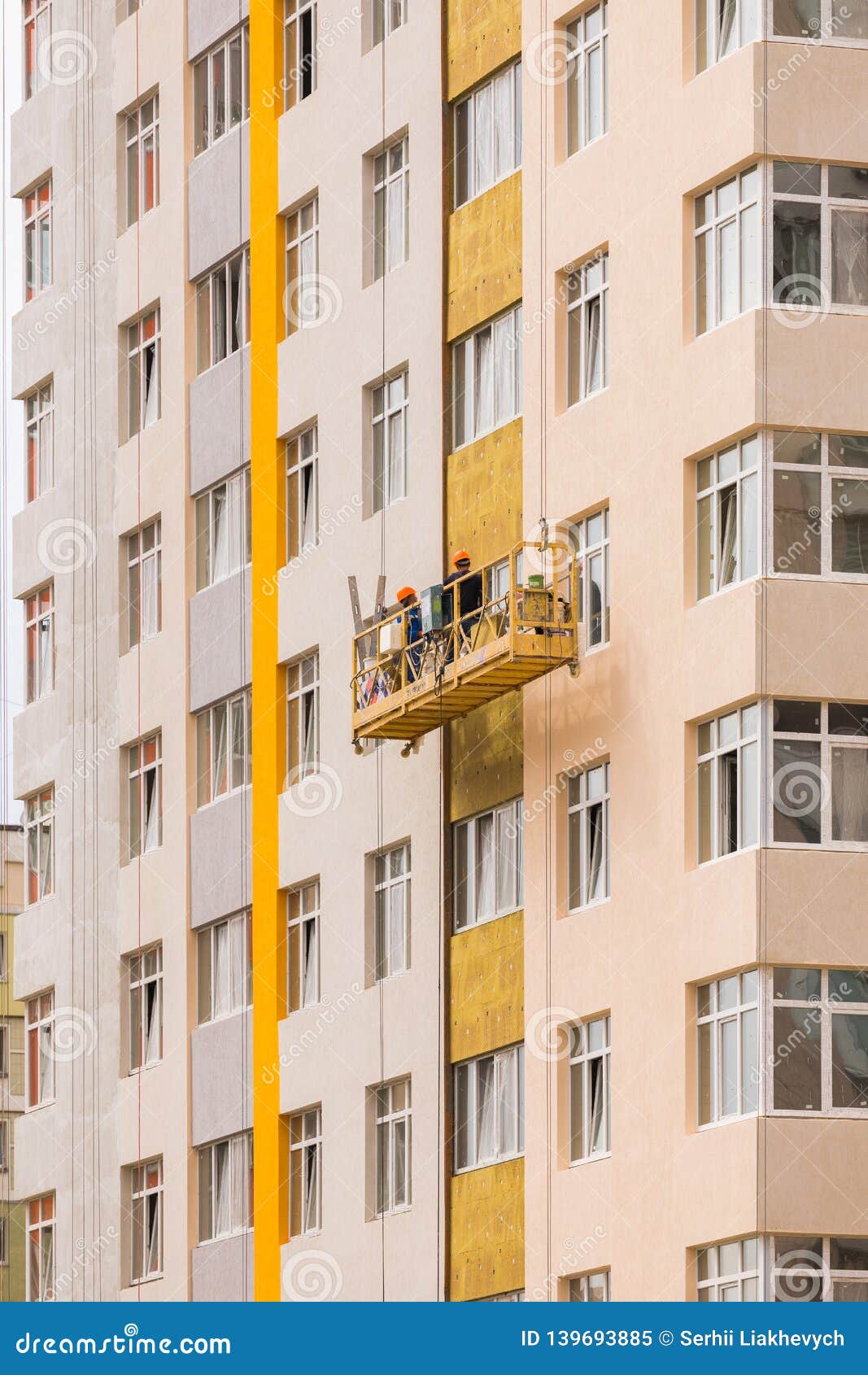 Builders Paint the Facade of a High-rise Residential Building Stock ...