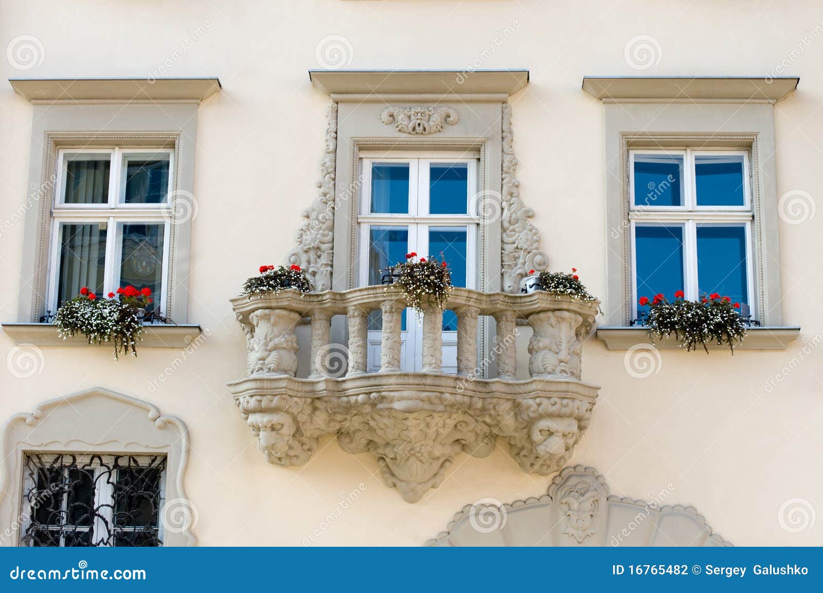 Facade of a Building with a Balcony and Flowers Stock Photo - Image of ...