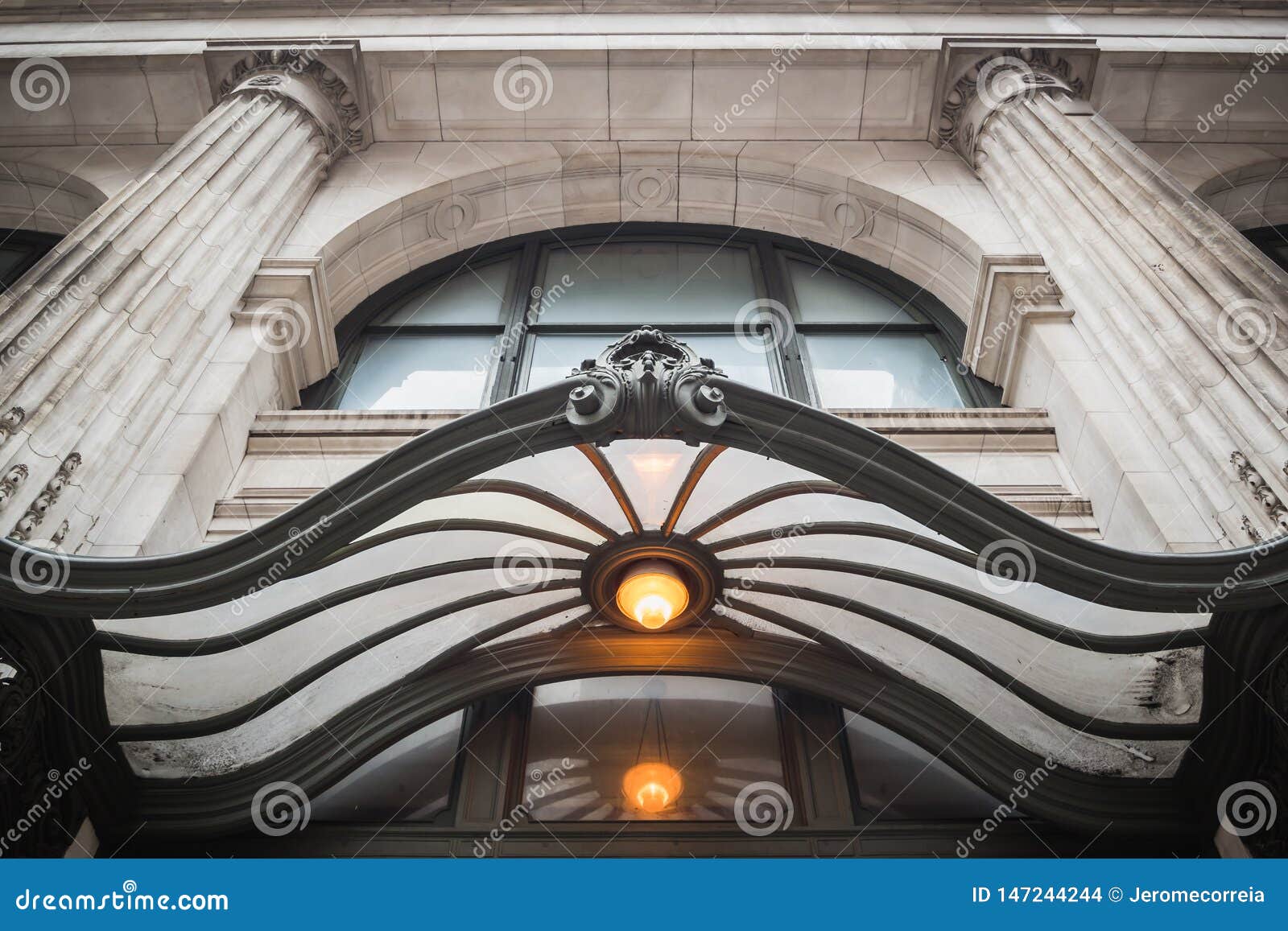 Facade Of A Building With Columns Above A Canopy At The Entrance Of A ...