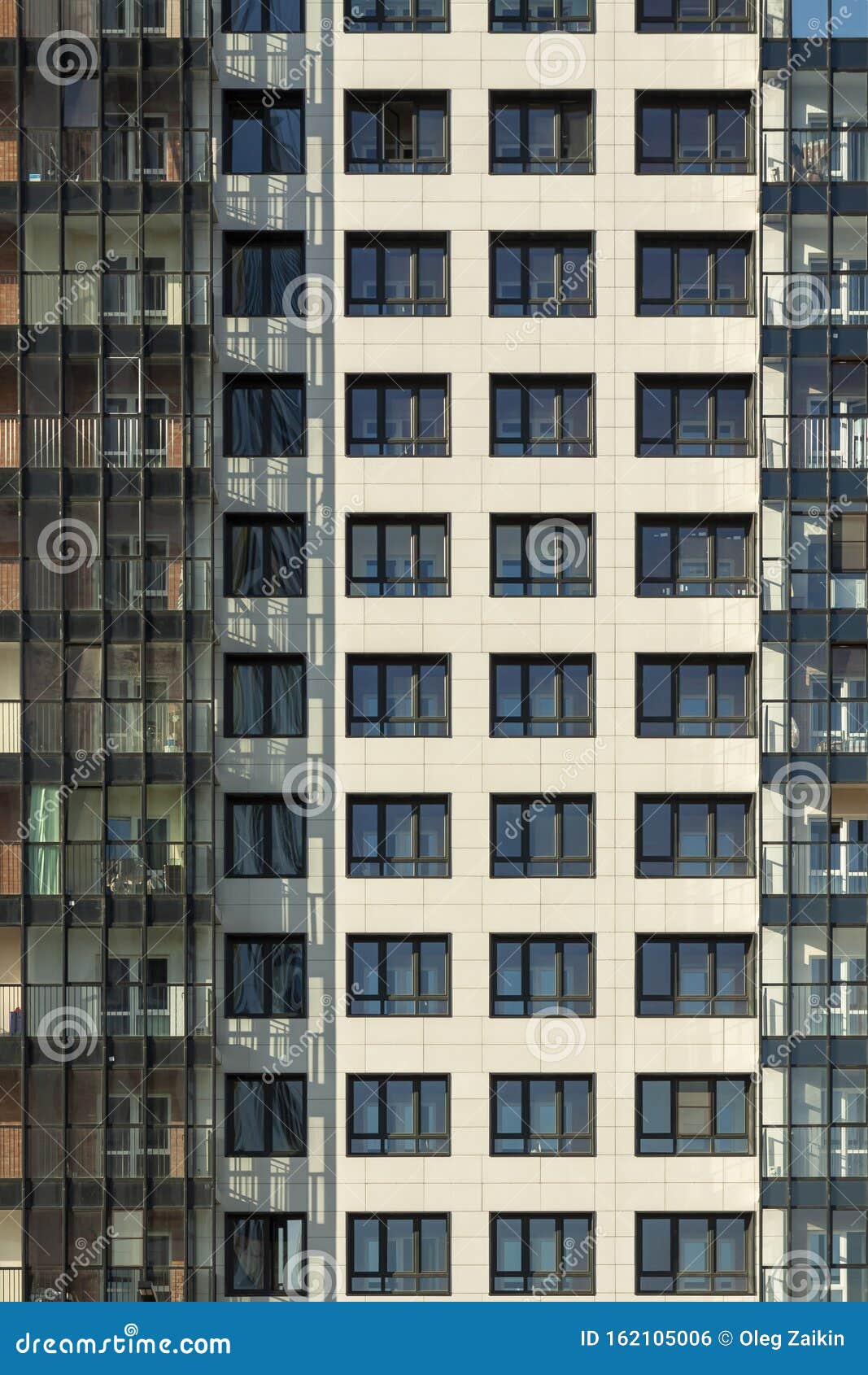 The Facade of the Building with Dark Windows and Light Walls. Stock ...
