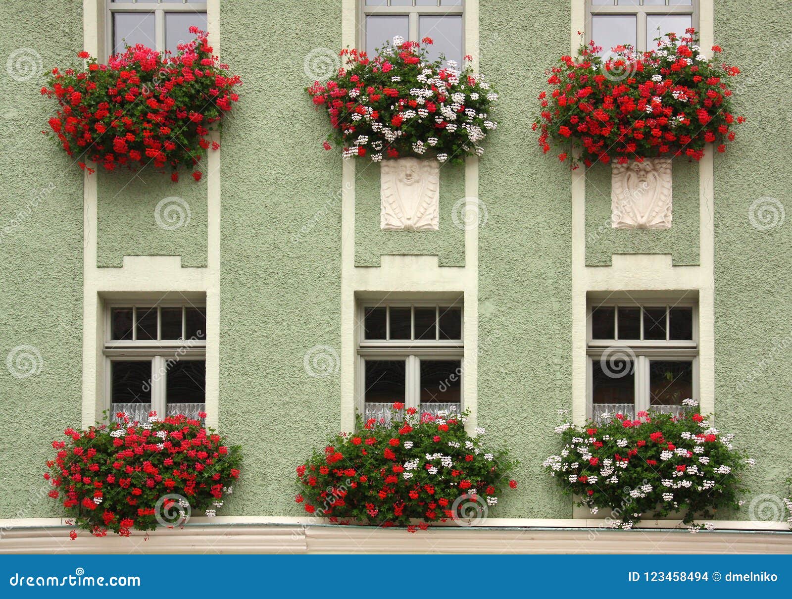 The Facade of the Building, Decorated with Flowers Stock Photo - Image ...