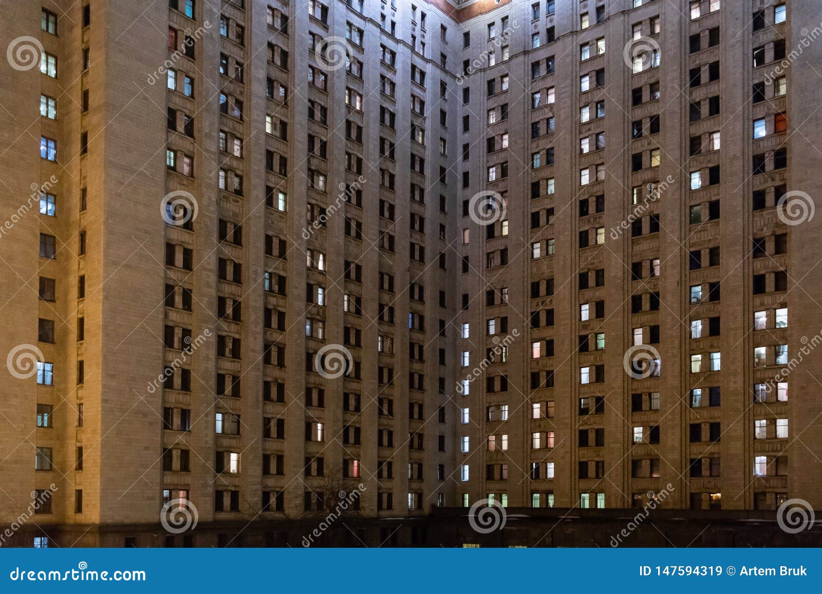 The Facade of the Building with the Glowing Windows Stock Image - Image ...