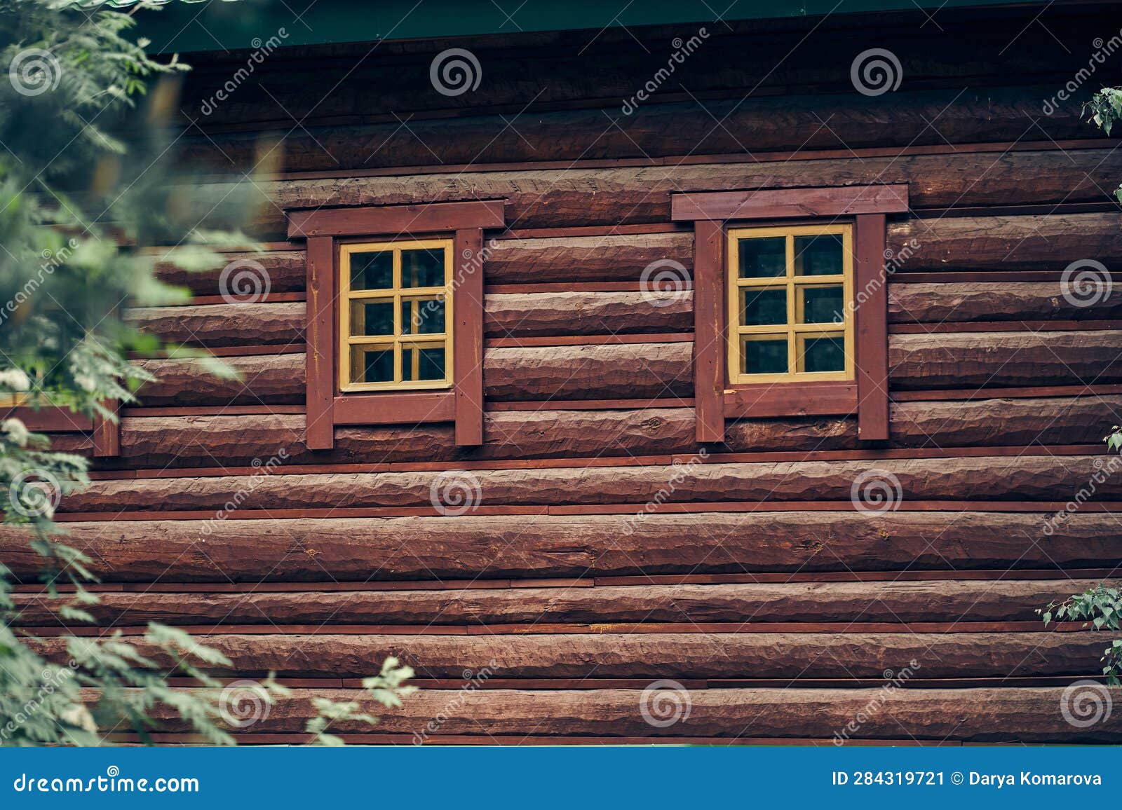 The Facade of the Building is Made of Rounded Logs with Brown Dark ...
