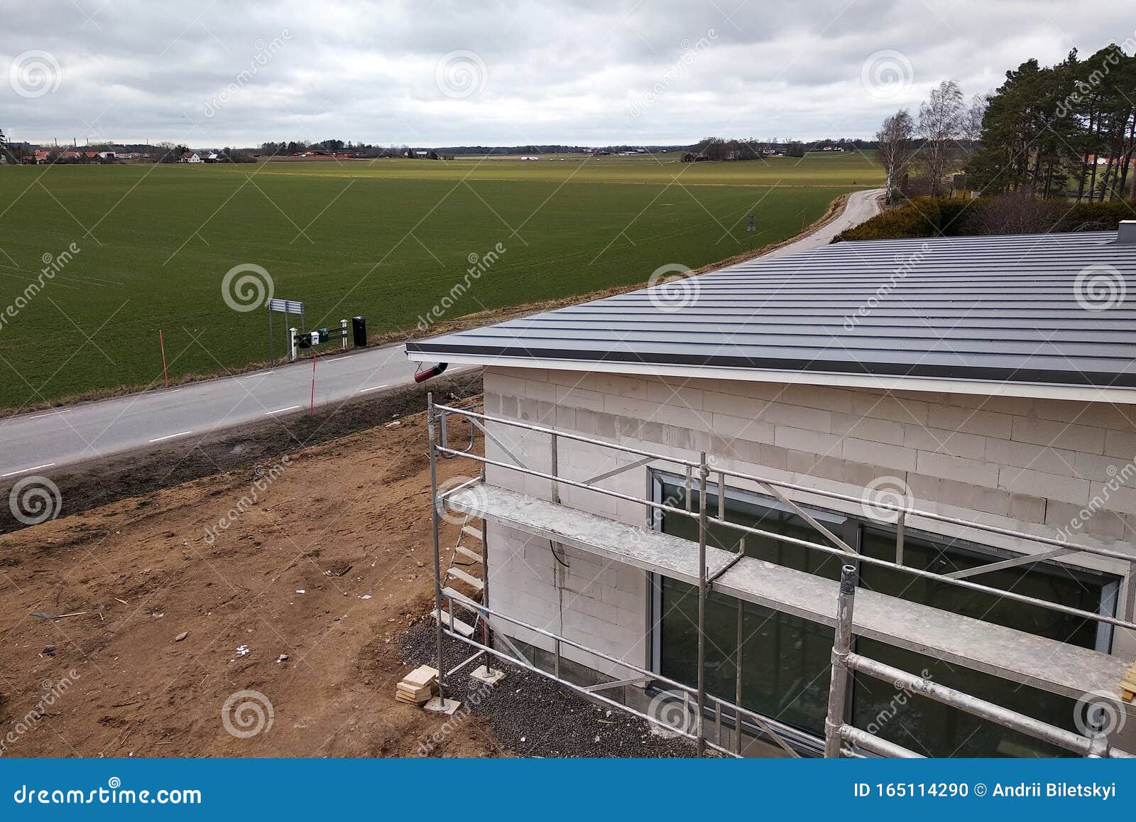Facade of Building Made from White Blocks with Big Windows Under ...