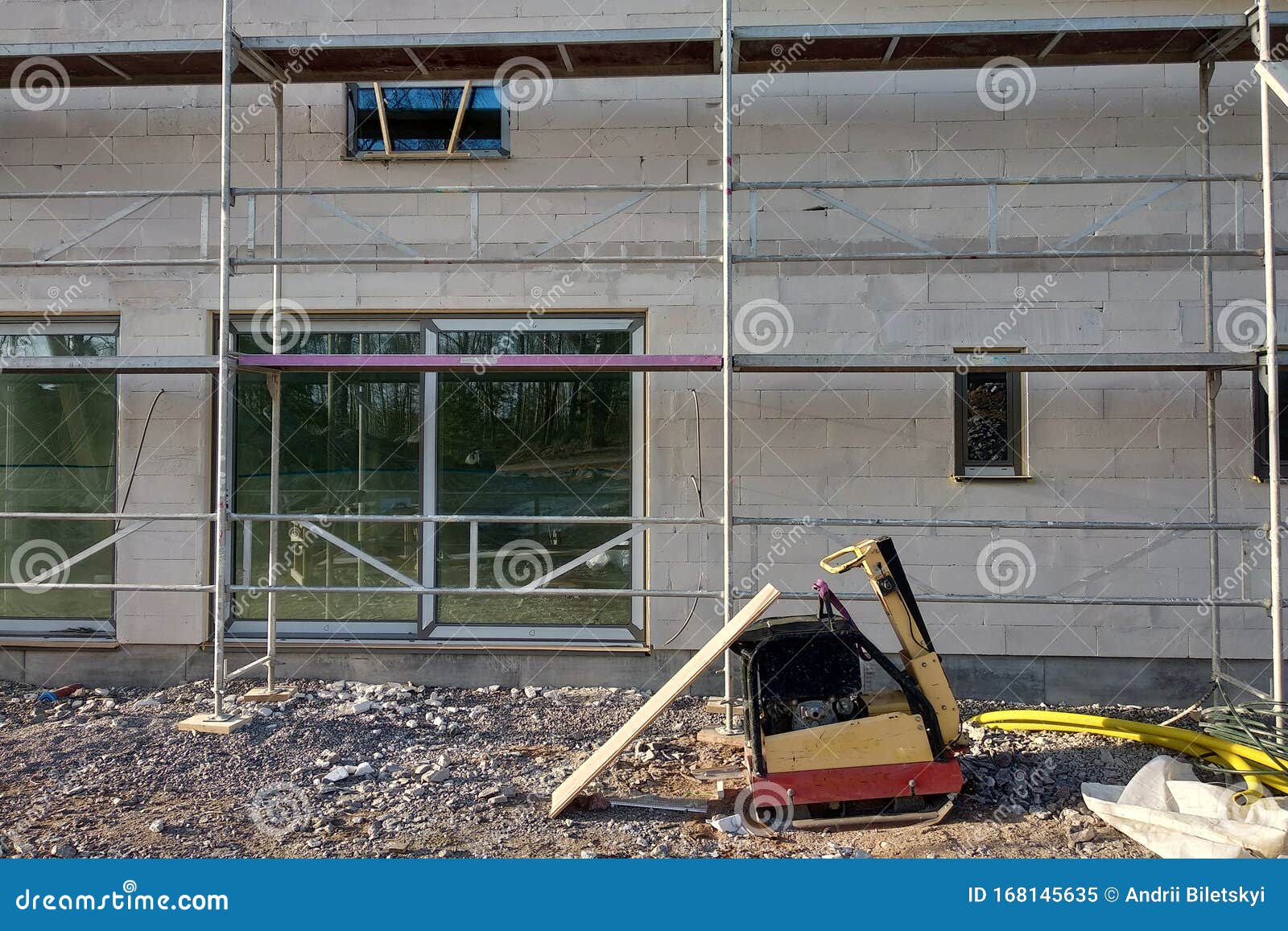Facade of Building Made from White Blocks with Big Windows Under ...
