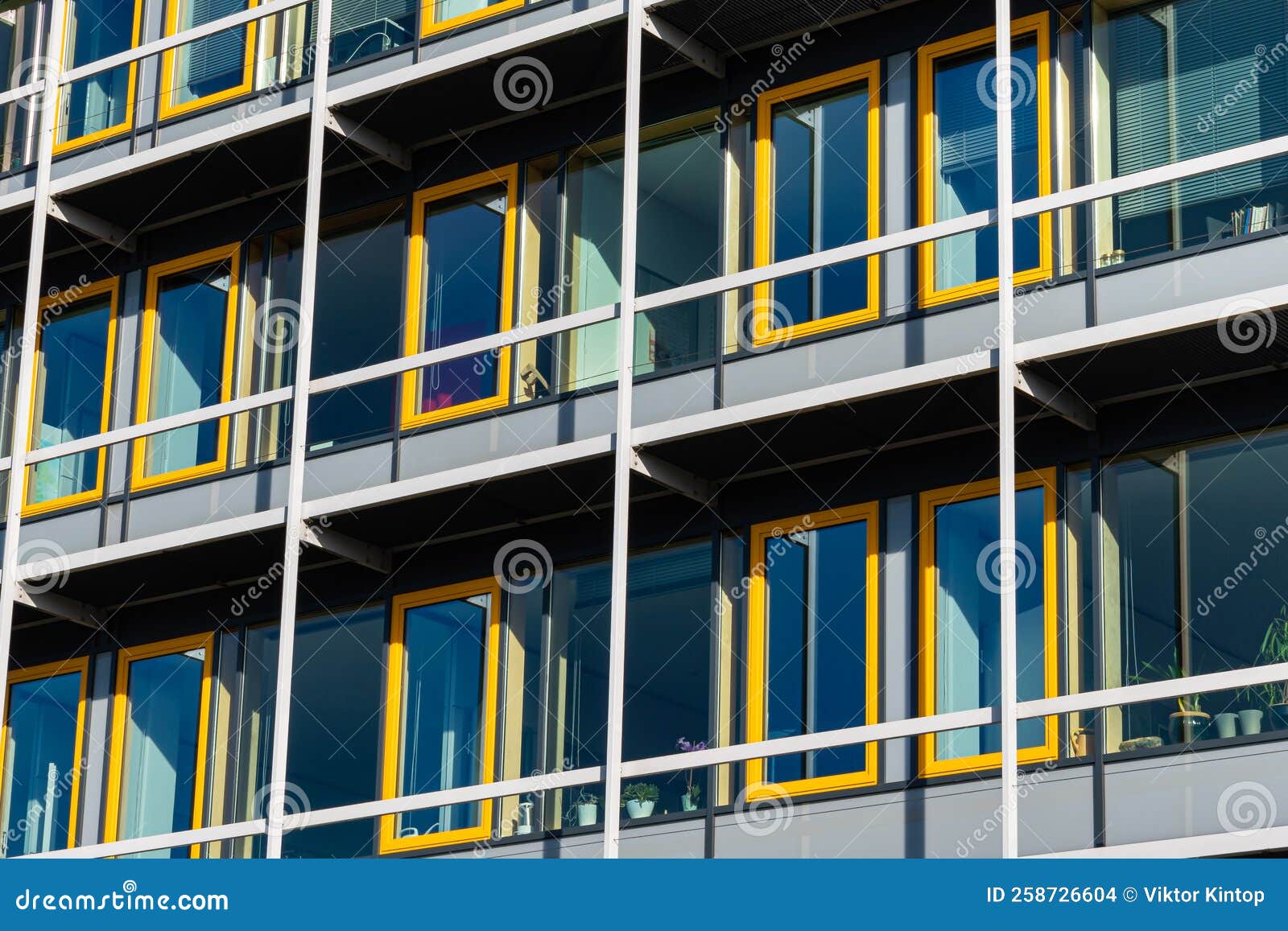 Facade of the Building with Rectangular Yellow Windows Stock Photo ...