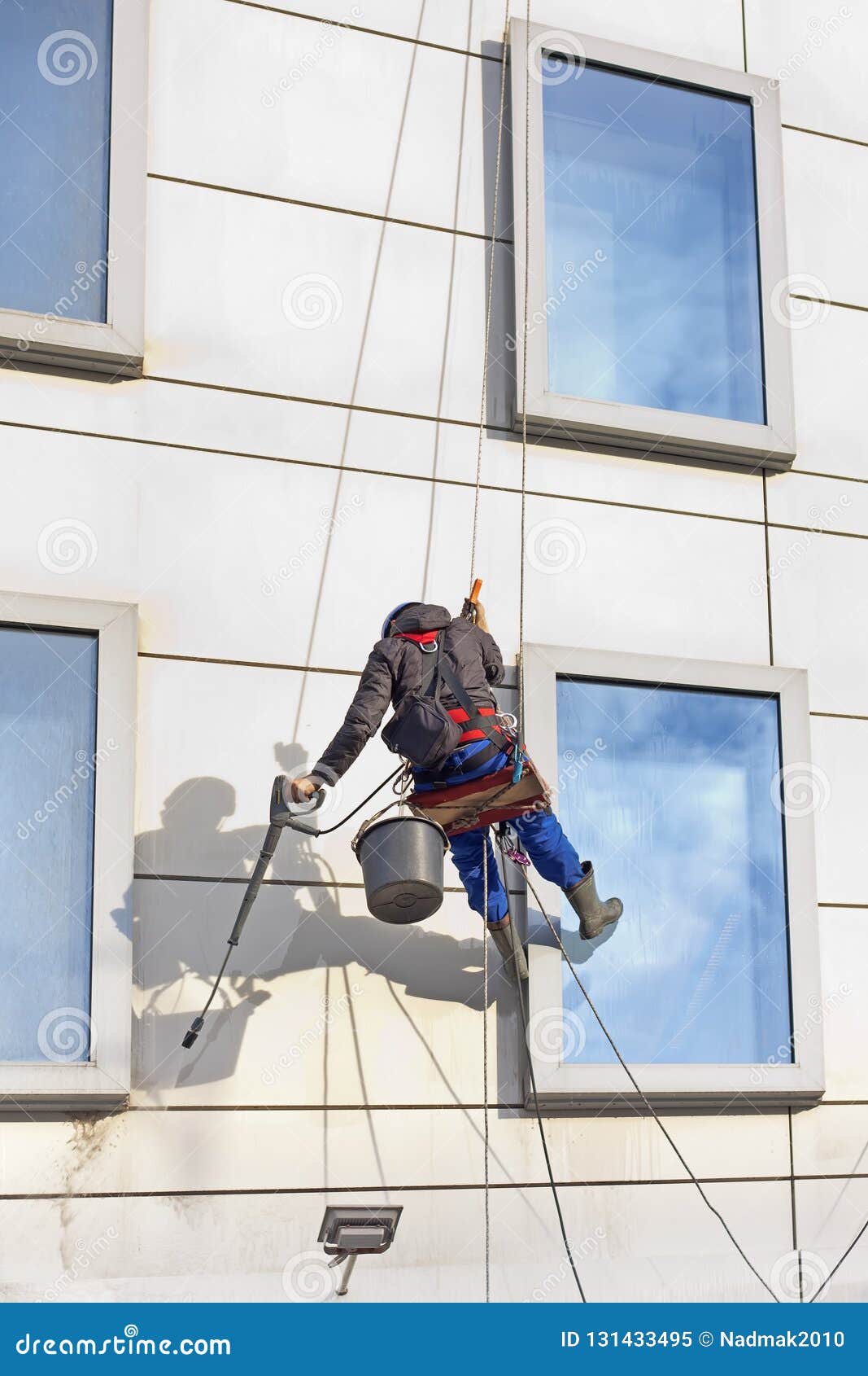 Facade cleaning at height stock image. Image of window - 131433495