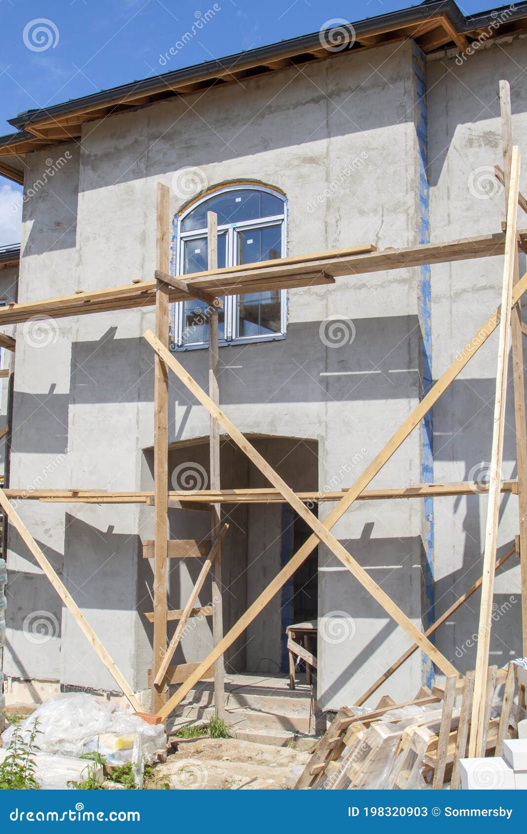 Facade Of Cottage Under Construction Covered With Plaster With New ...