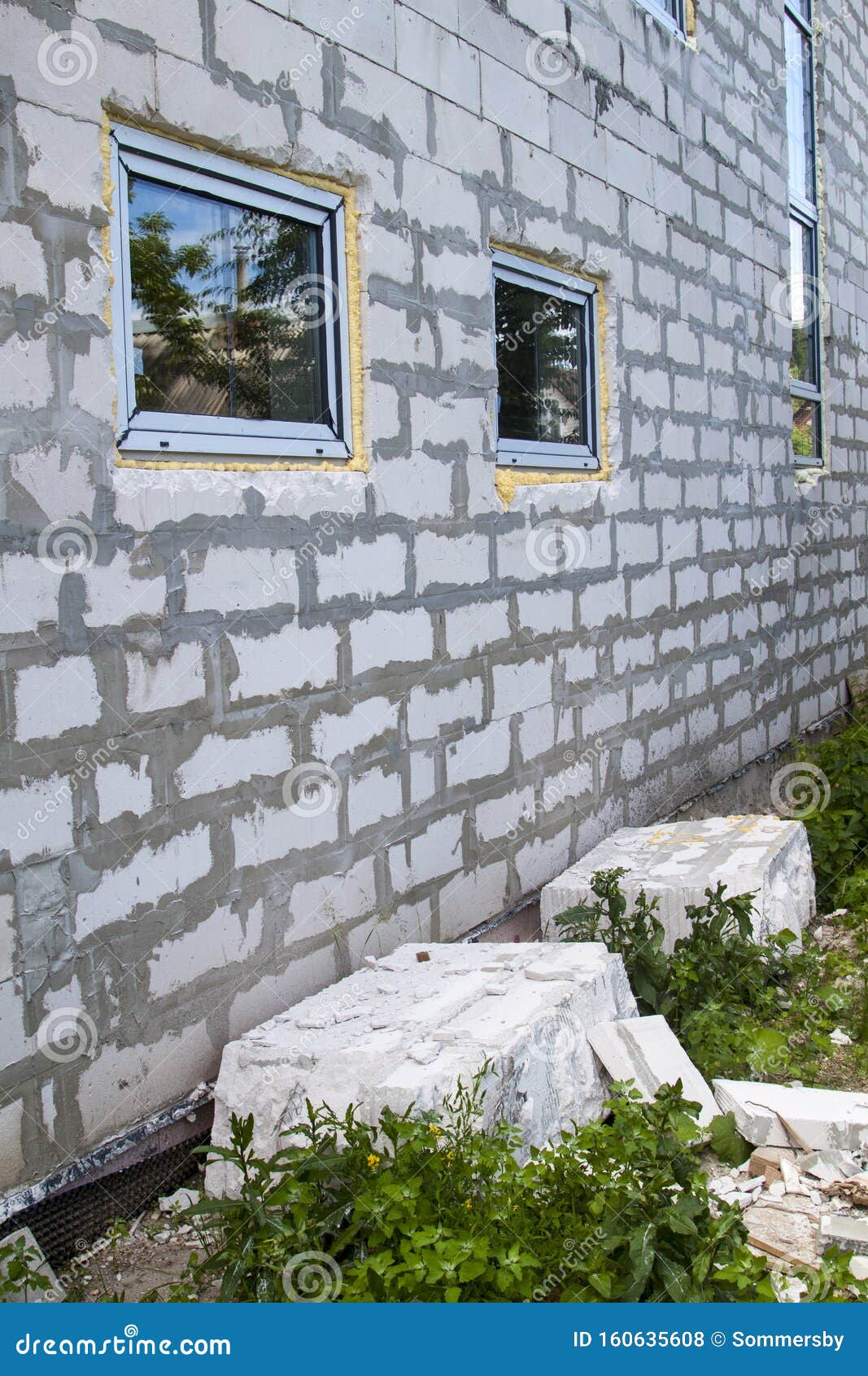 Facade of Cottage Under Construction with New Inserted Windows. Blocks ...
