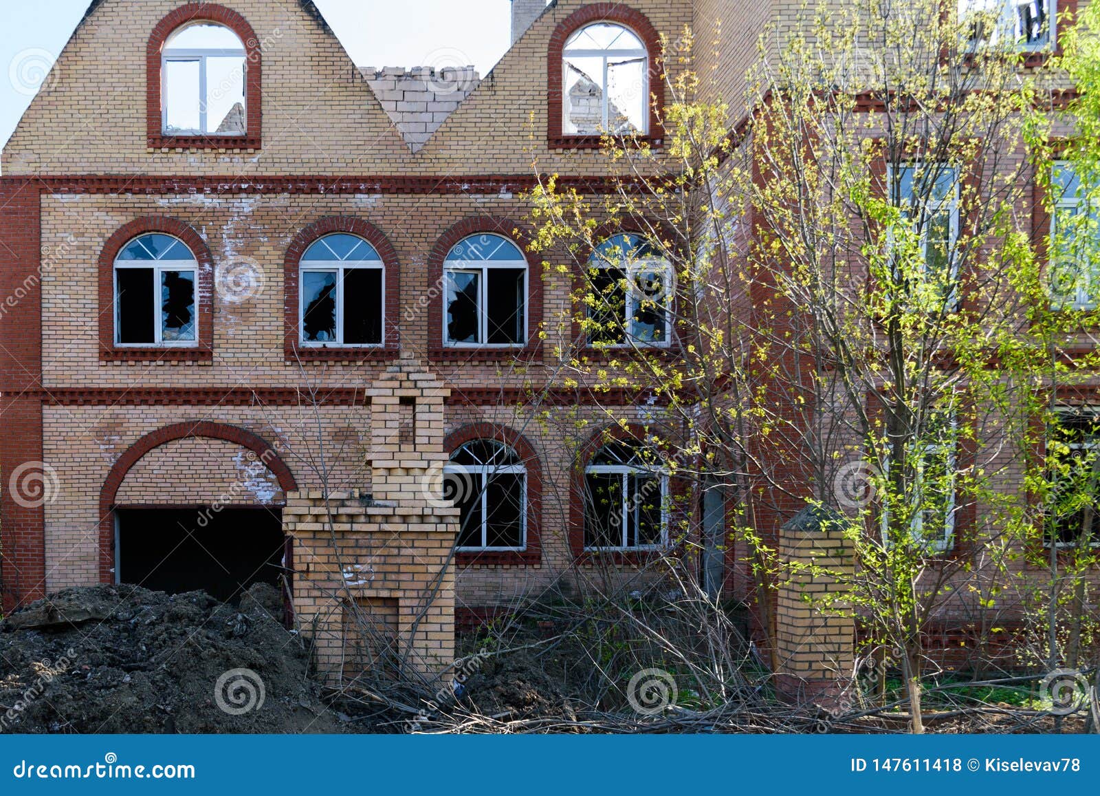 Facade of a Destroyed Brick Building with Broken Windows Stock Photo ...