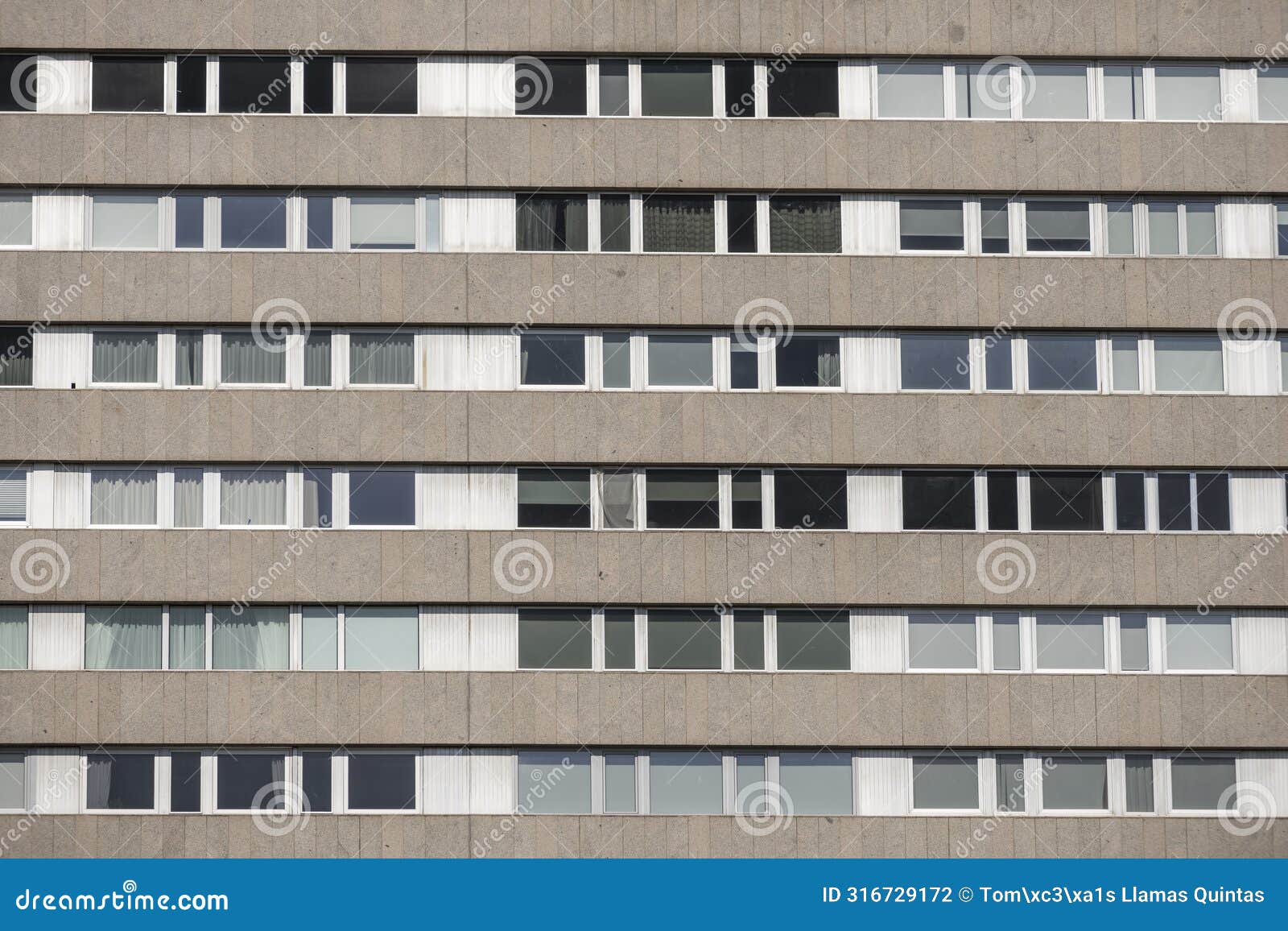 Facade with Granite Cladding and a Multitude of Similar Windows Stock ...