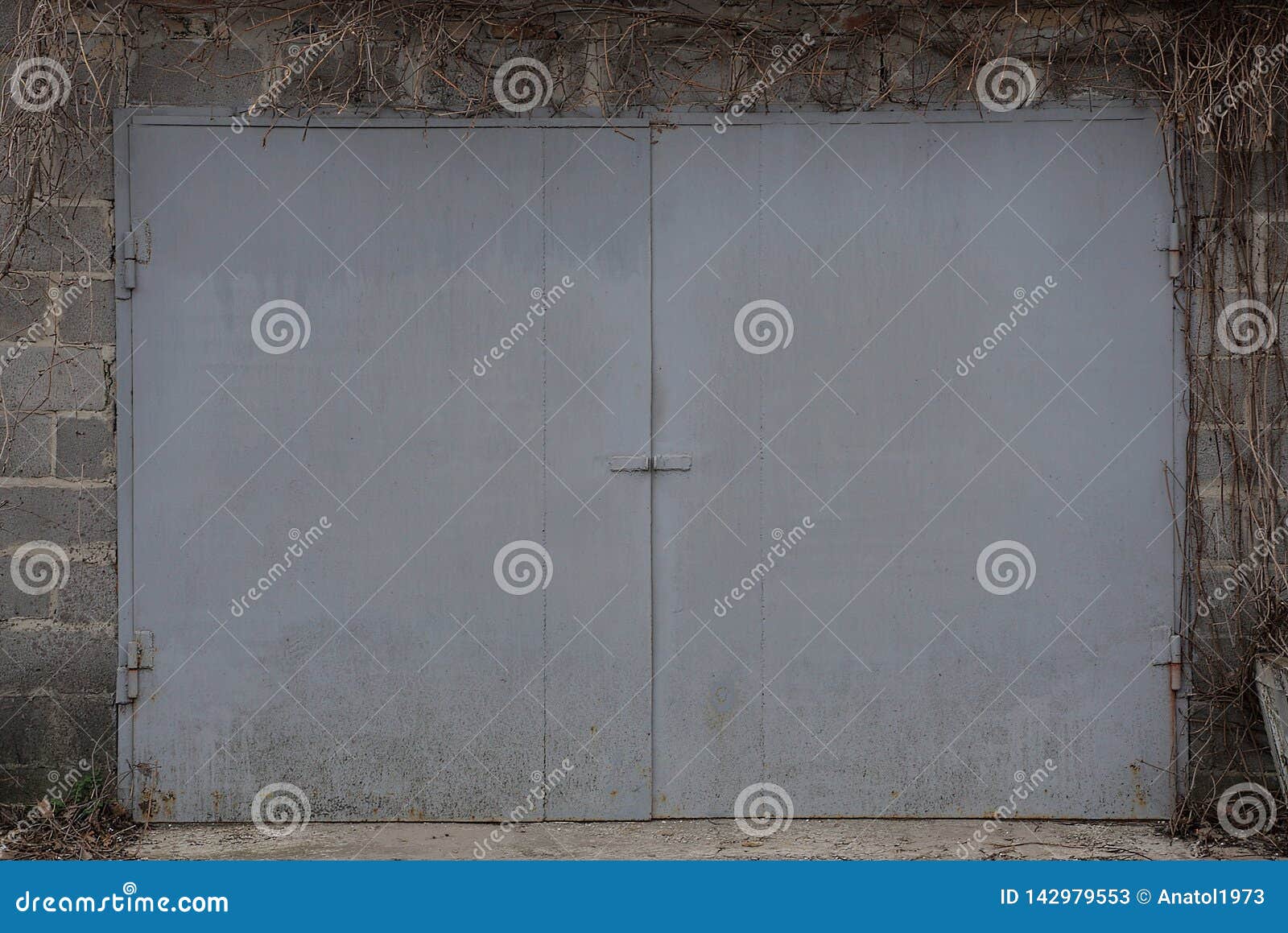Facade of a Gray Brick Garage with Iron Gates Closed Stock Image ...