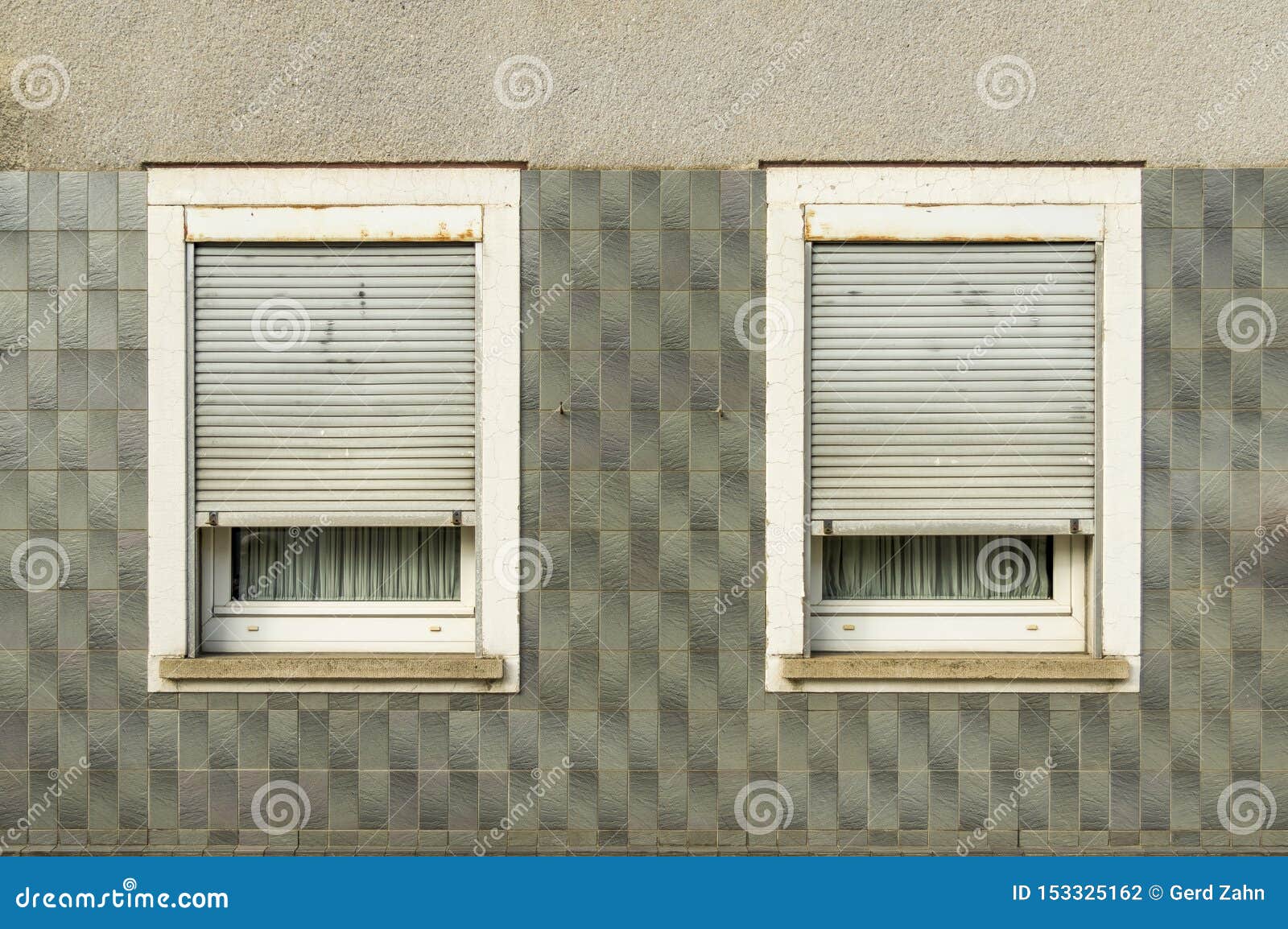 Facade Half Tiled, Plastered Over Windows with Half-closed Shutters and ...