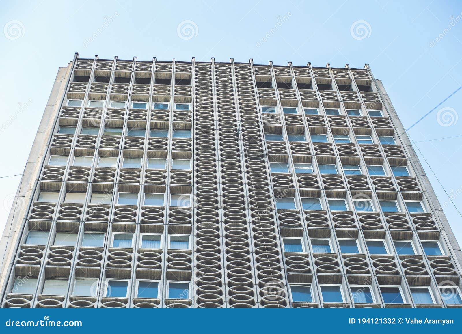 Facade of High Rise Building with Sunlight and Blue Sky Background ...