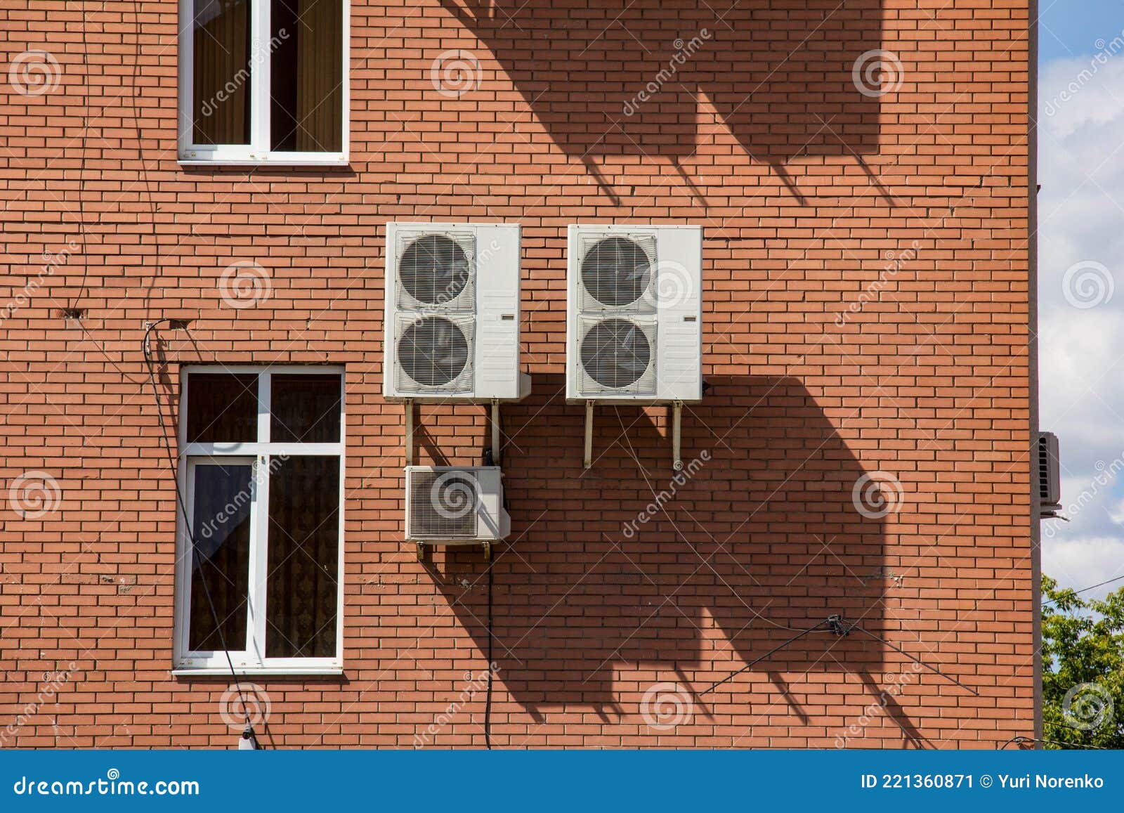 The Facade of the House is Made of Red Brick with Air Conditioning ...