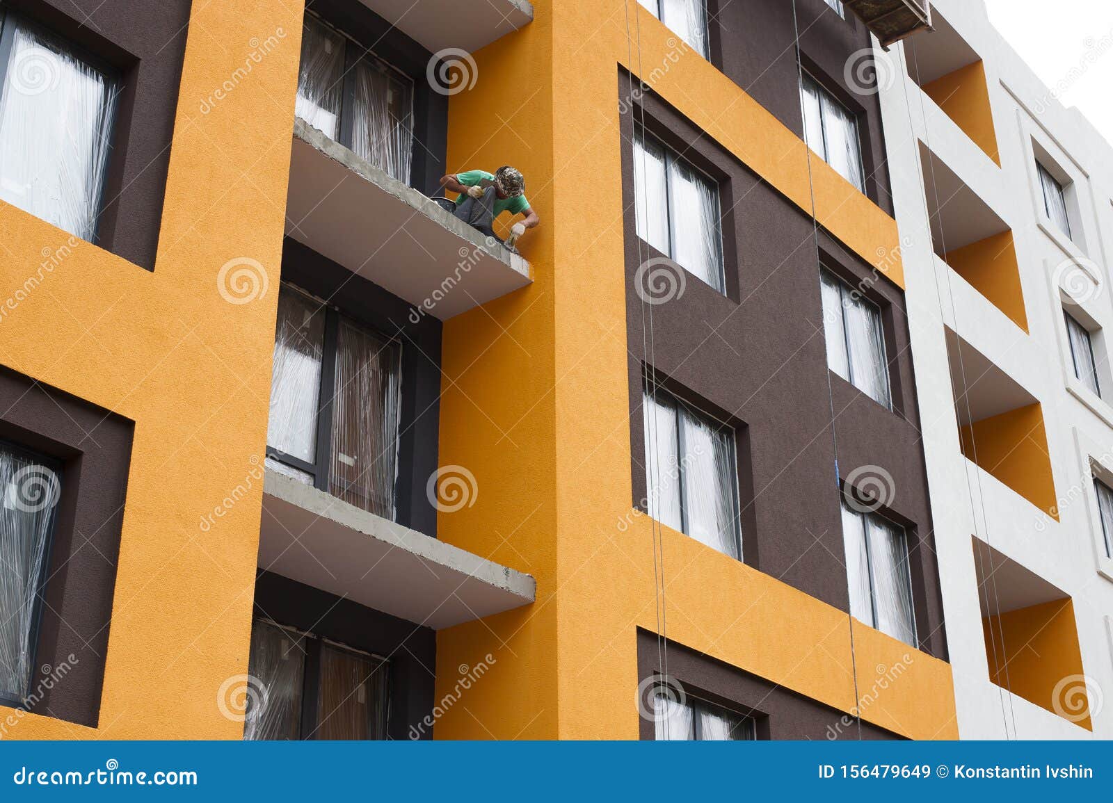 Facade of the House Under Construction with Multi-colored Decorative ...