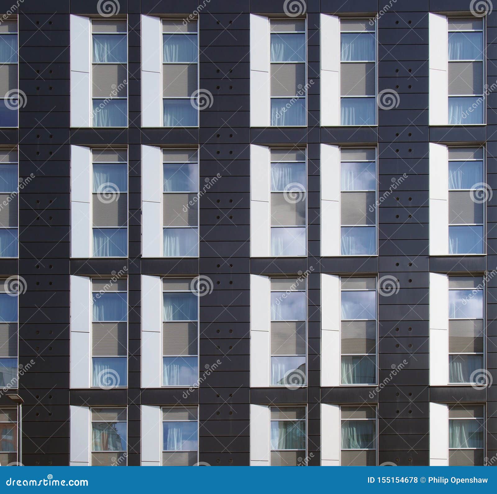 Facade of a Large Black and White Modern Commercial Building with ...