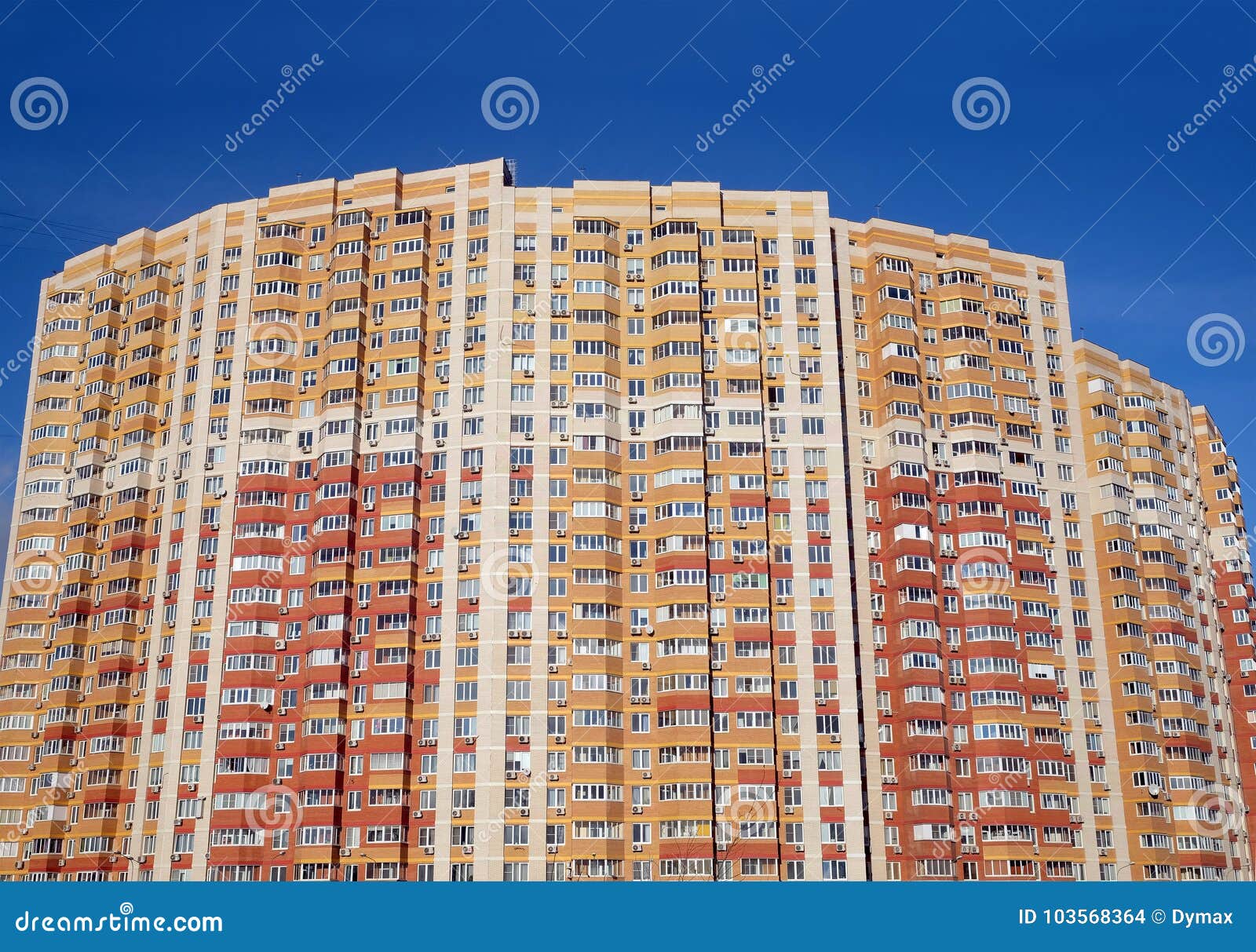 Facade of a Large Multi-storey Block of Flats with Many Windows Over ...