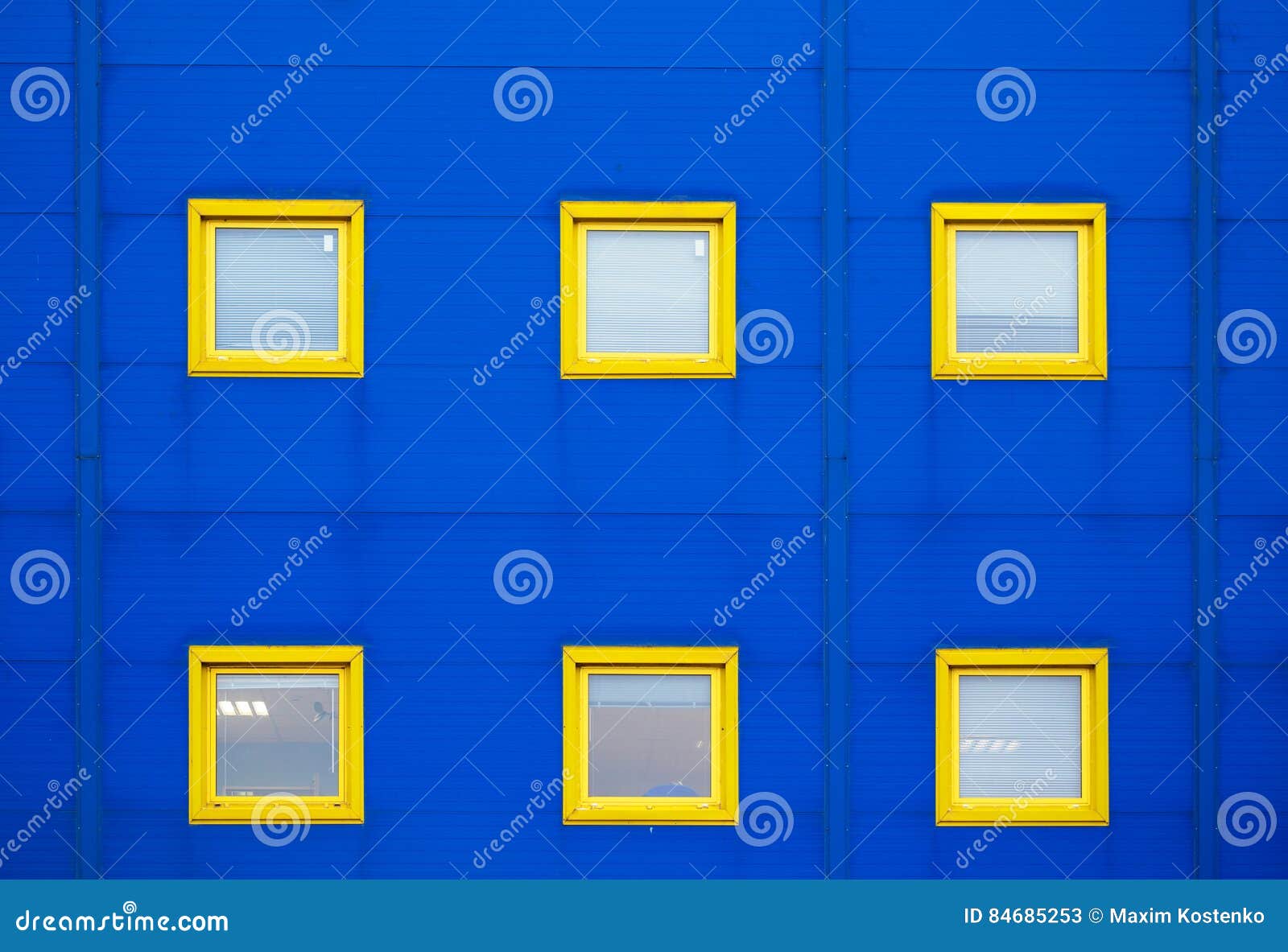 Facade of a Modern Blue Warehouse and Six Yellow Windows Stock Image ...