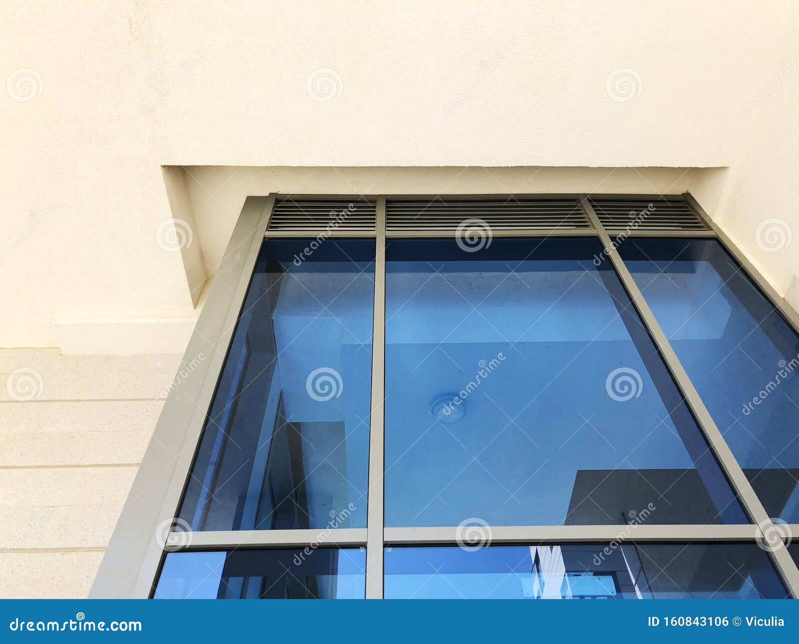 Facade of Modern Building with Rectangular Turquoise Glass Bay Windows ...