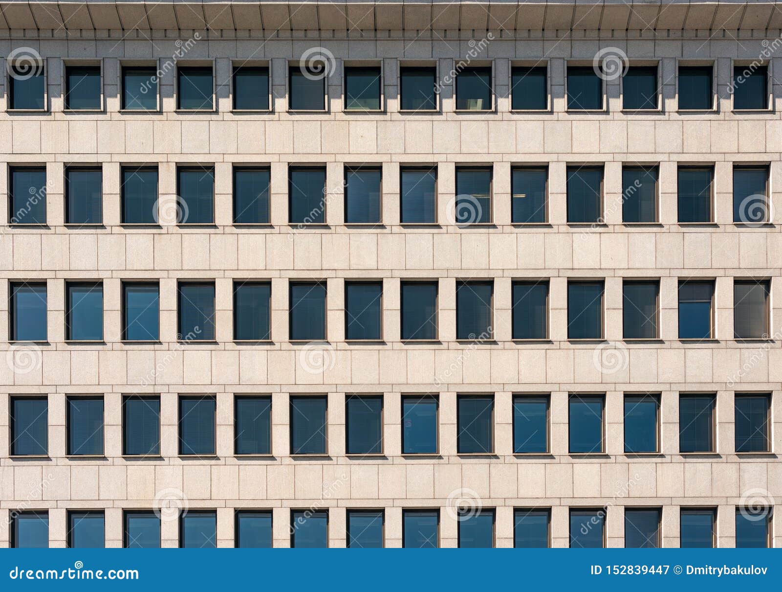 The Facade of the Modern Building with Rectangular Windows and Cornice ...