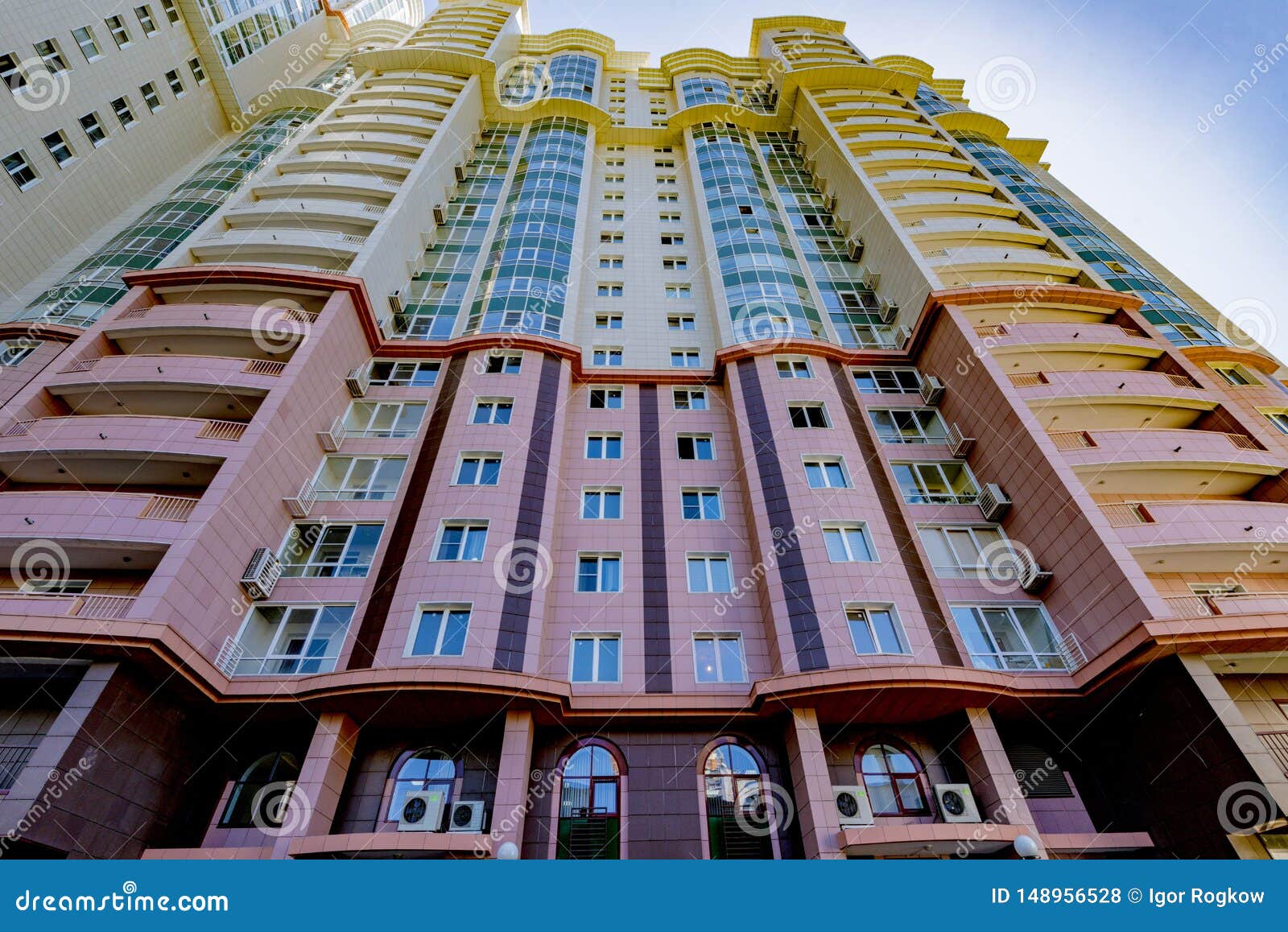The Facade of a Modern Multi-storey High-rise Building with Windows in ...