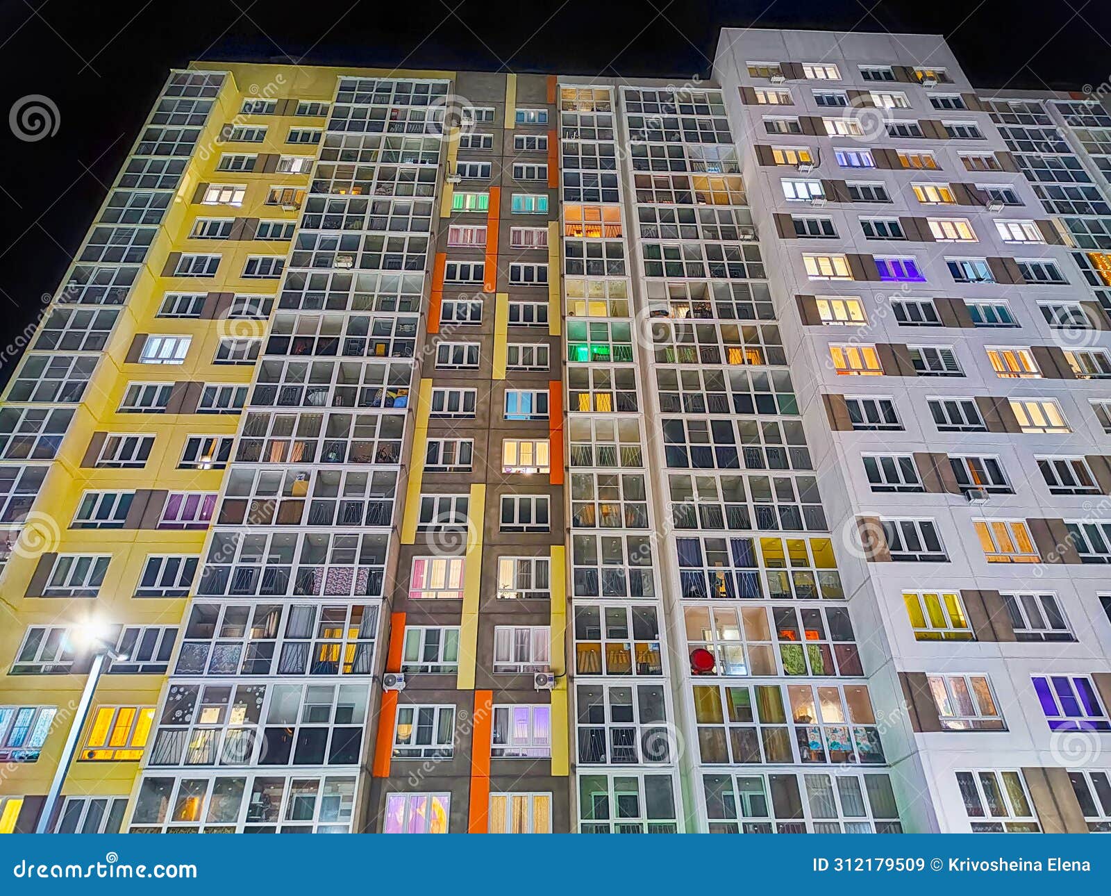 The Facade of a Multi-storey Building with Multi-colored Windows at ...