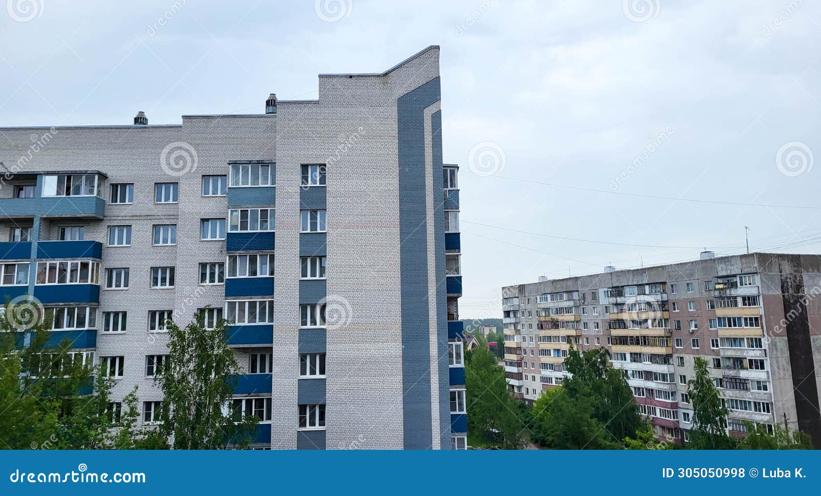 The Facade of a Multi-storey Building with a Sharp Angle and Blue ...