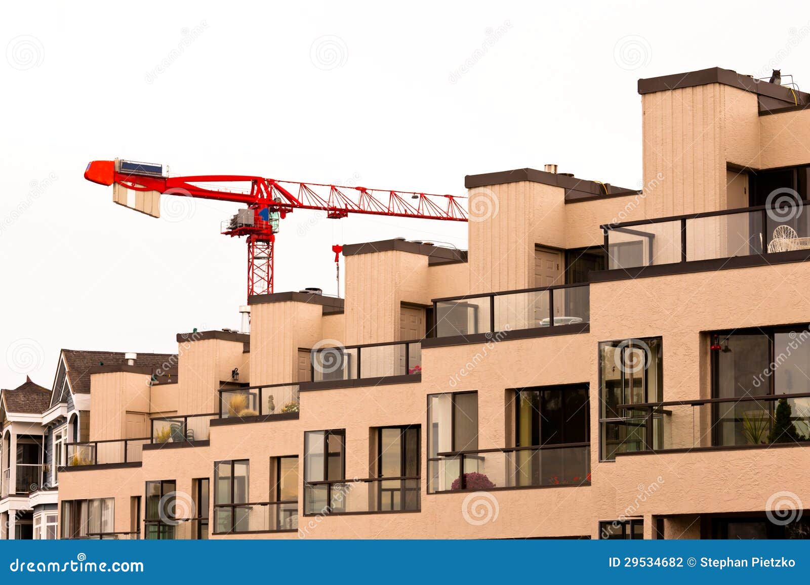 Facade of New Apartment Building and Tower Crane Stock Photo - Image of ...