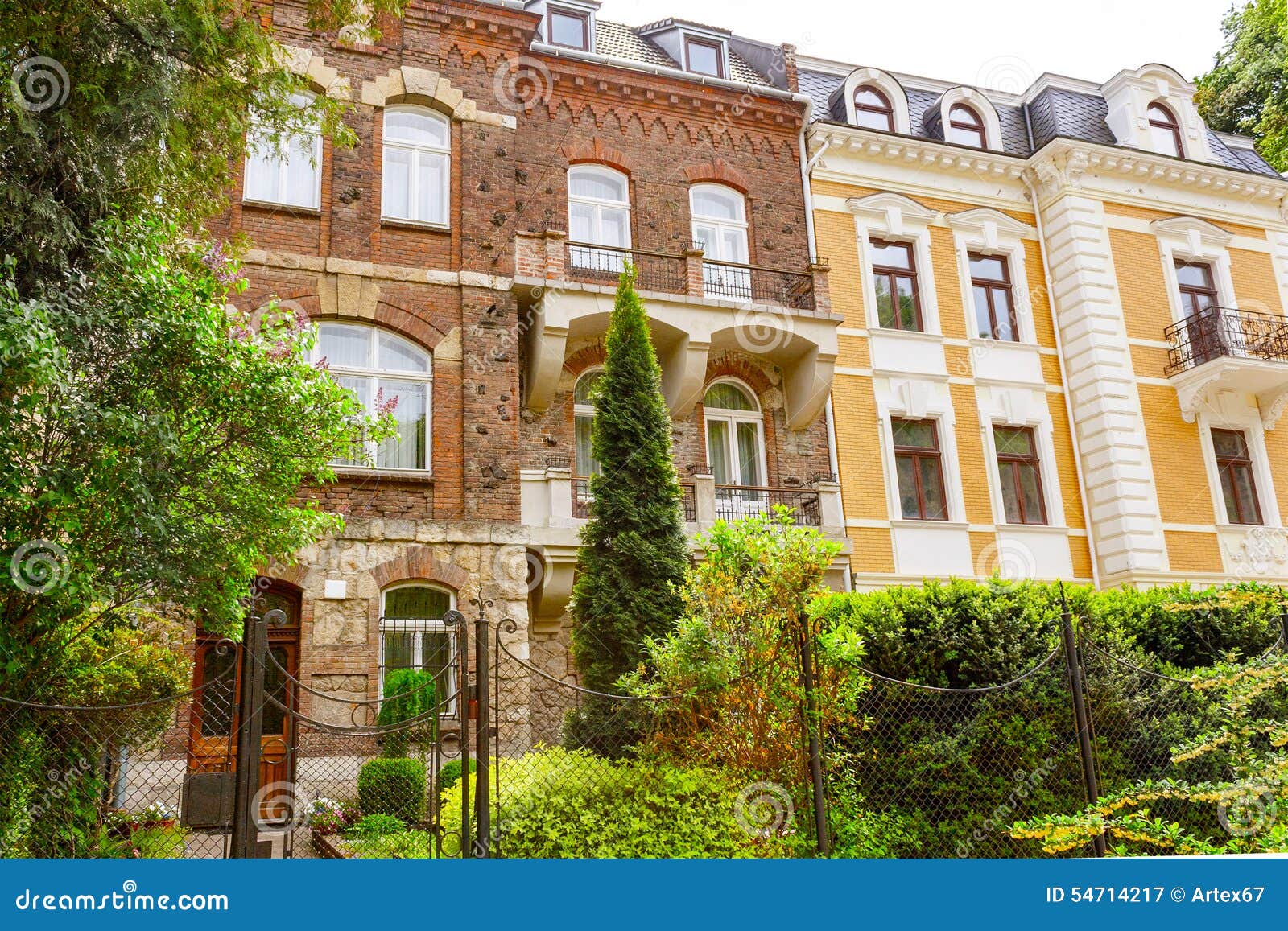Facade of the Old Brick Building of the Forged Fence Stock Image ...