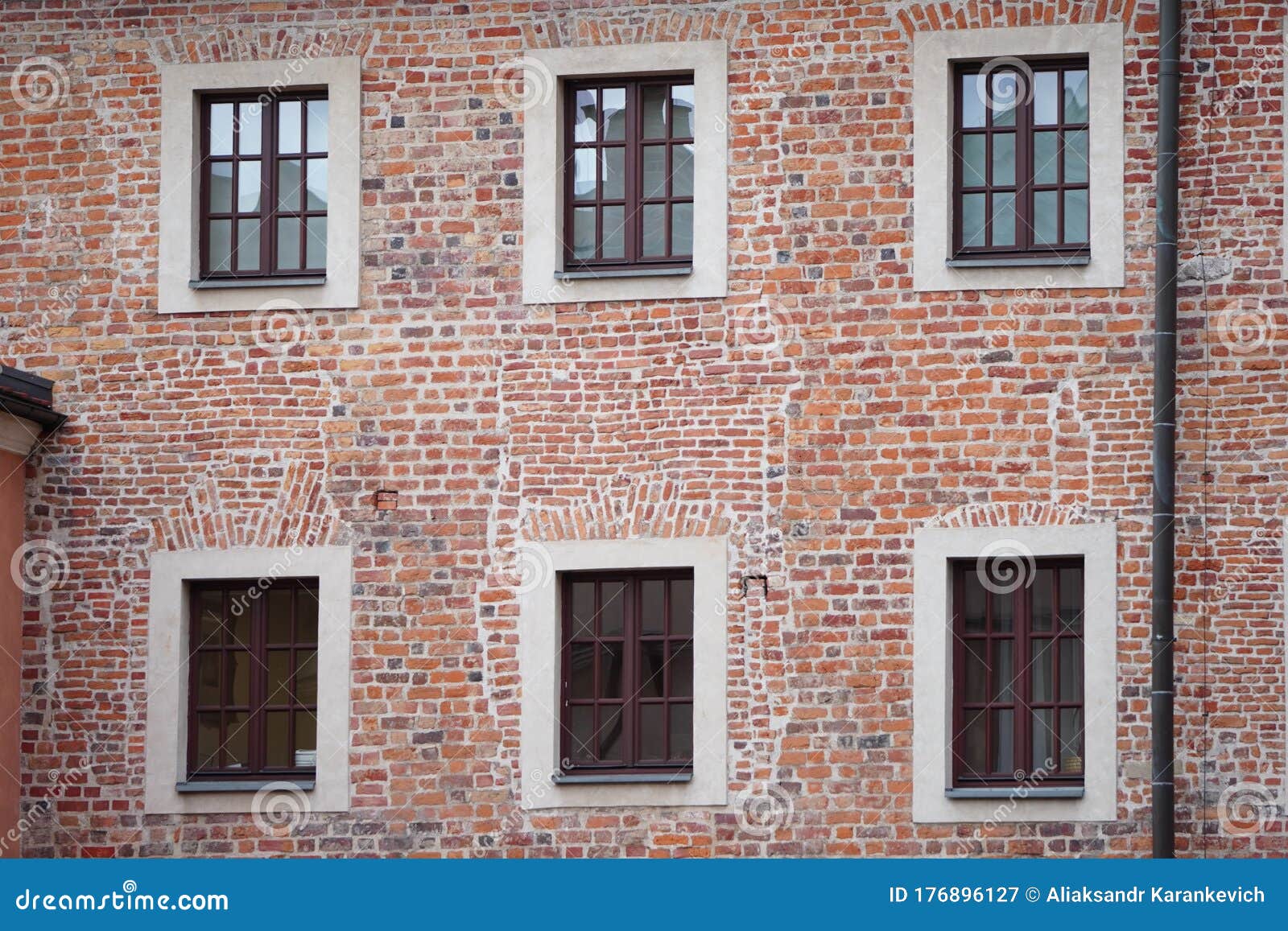 The Facade of an Old Brick Building with Windows or Cornices. Old Brick ...