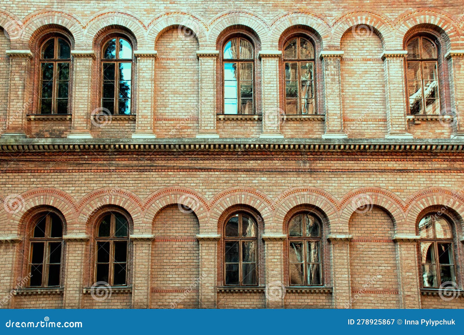 The Facade of an Old Building with Arched Red Brick Windows Stock Image ...