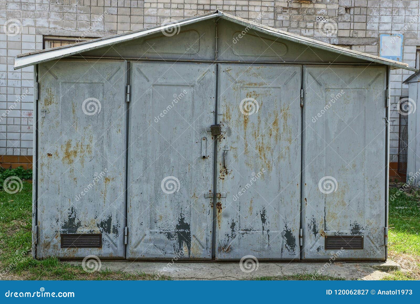 Facade of the Old Gray Iron Garage with Closed Gates Stock Image ...
