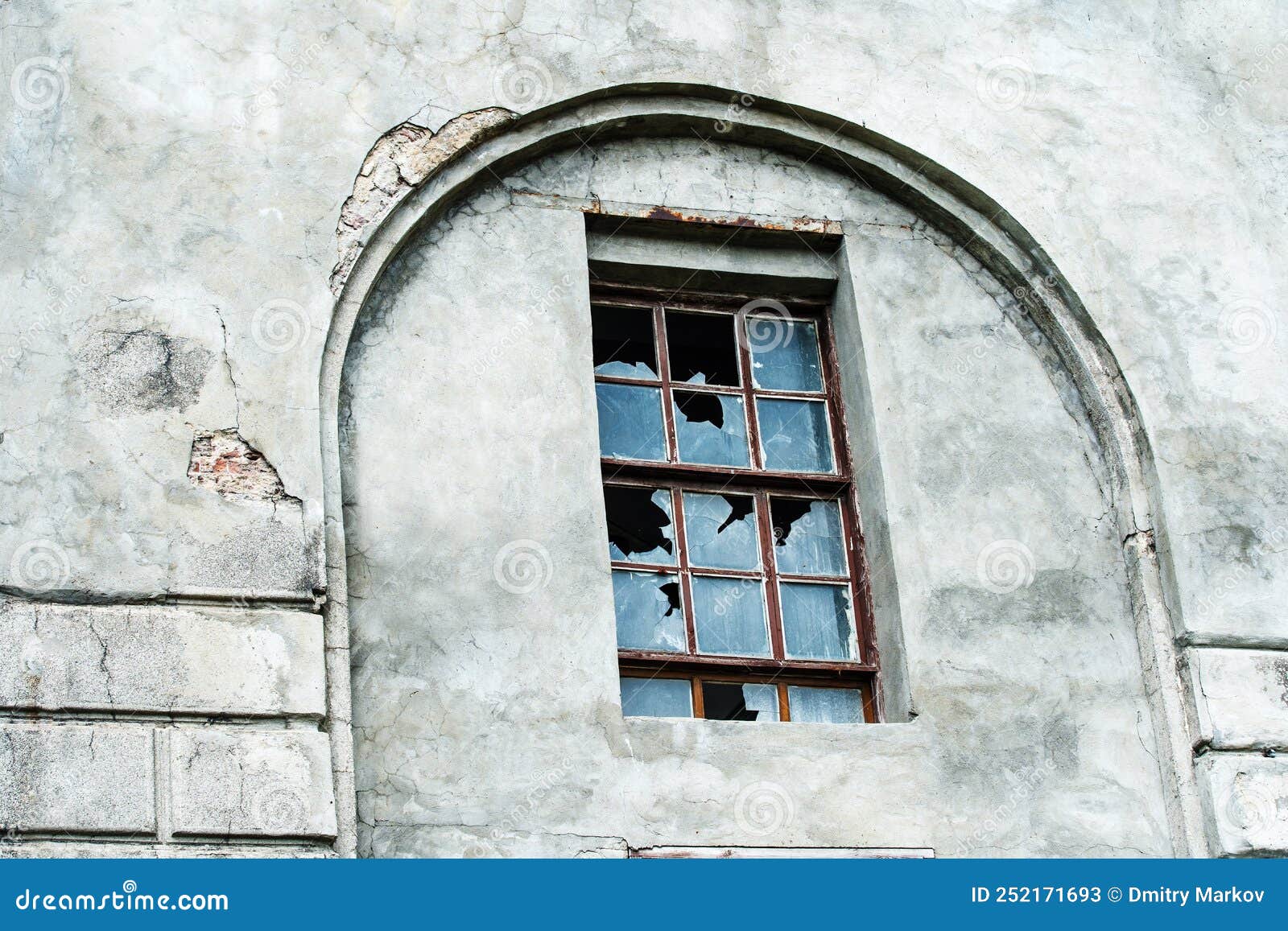 The Facade of an Old House with Broken Windows. Gray Wall with ...