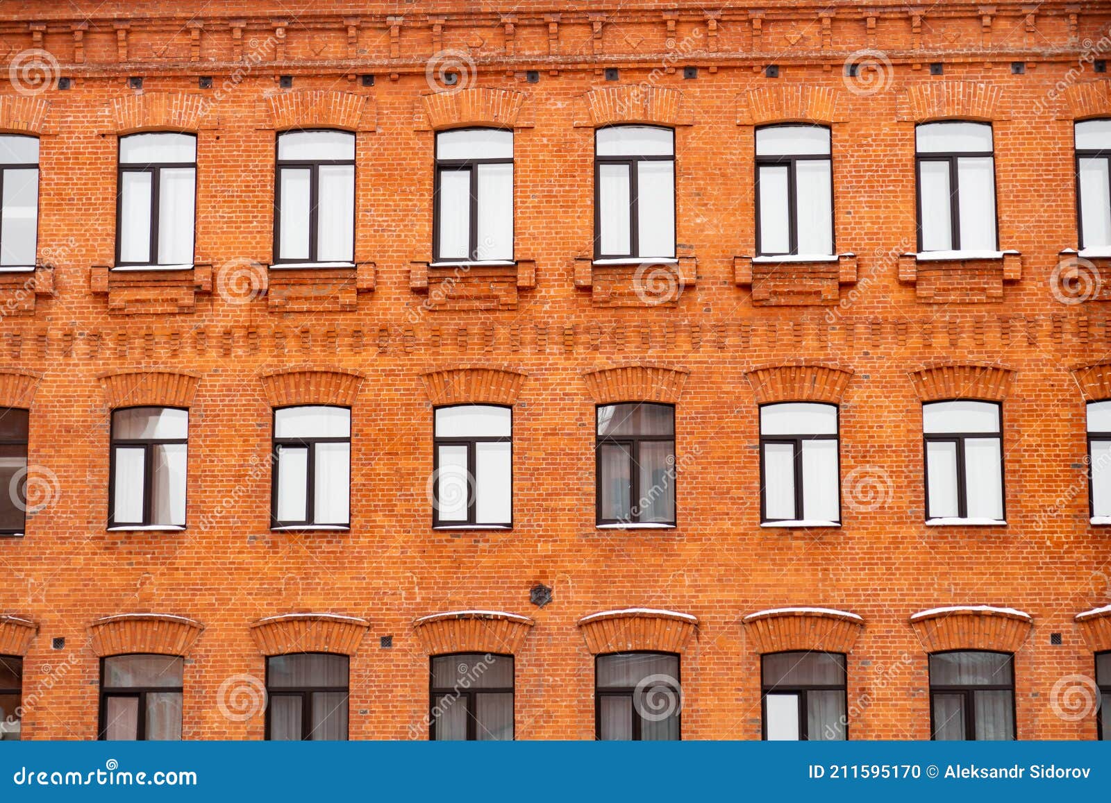 Facade of an Old Red Brick Masonry Building with Many Arched Windows ...