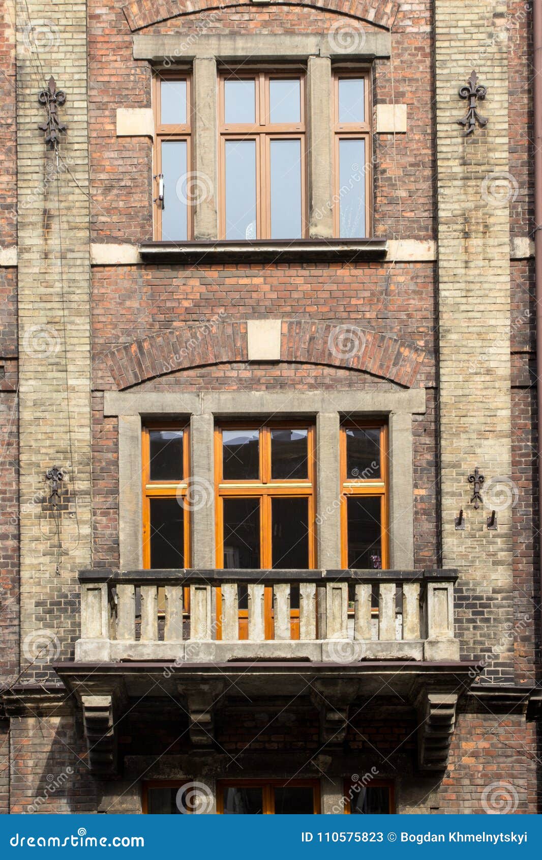 Facade of a Brick Building with a Balcony Stock Image - Image of ...
