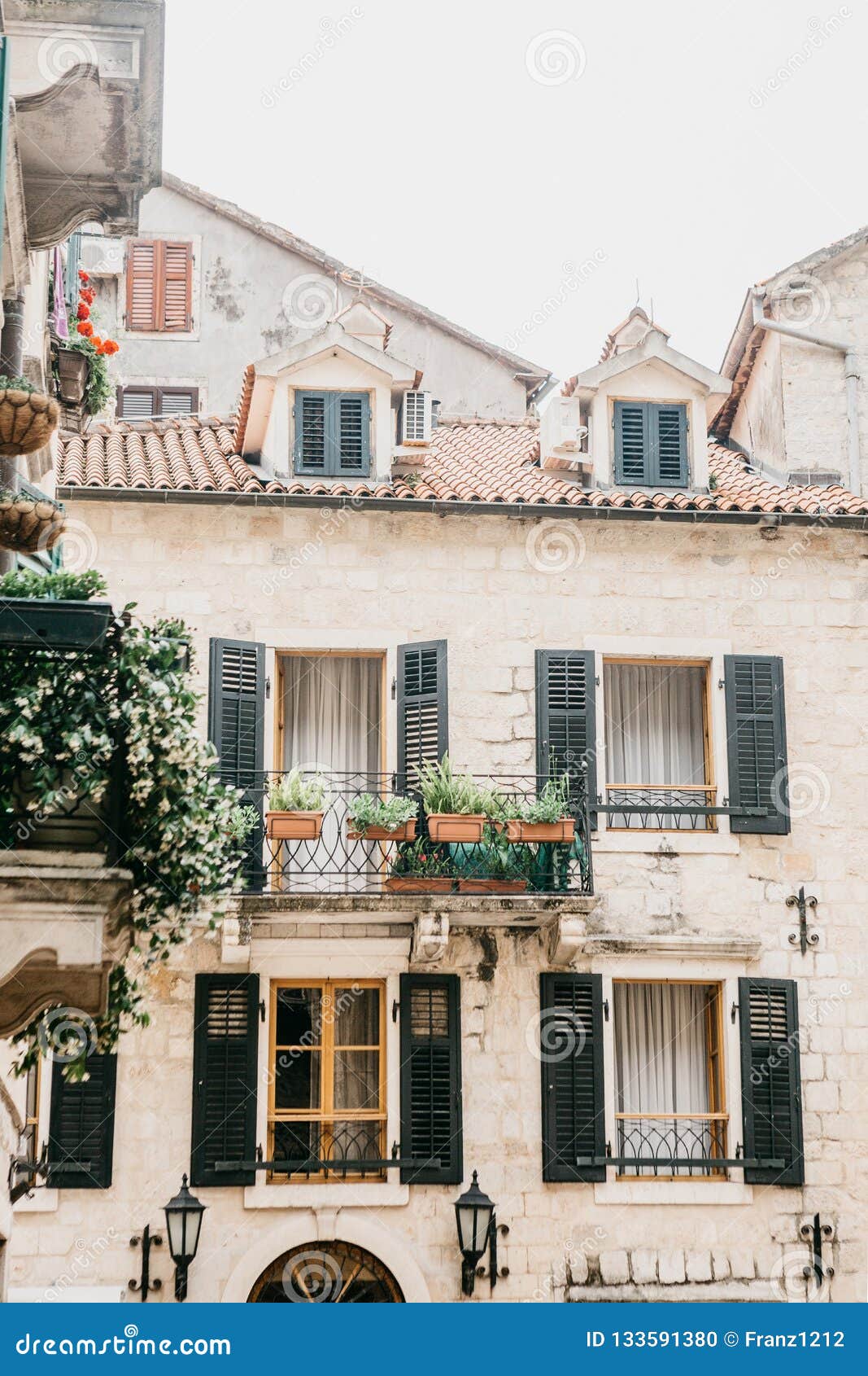 The Facade of an Ordinary Old Building with Windows in Montenegro ...