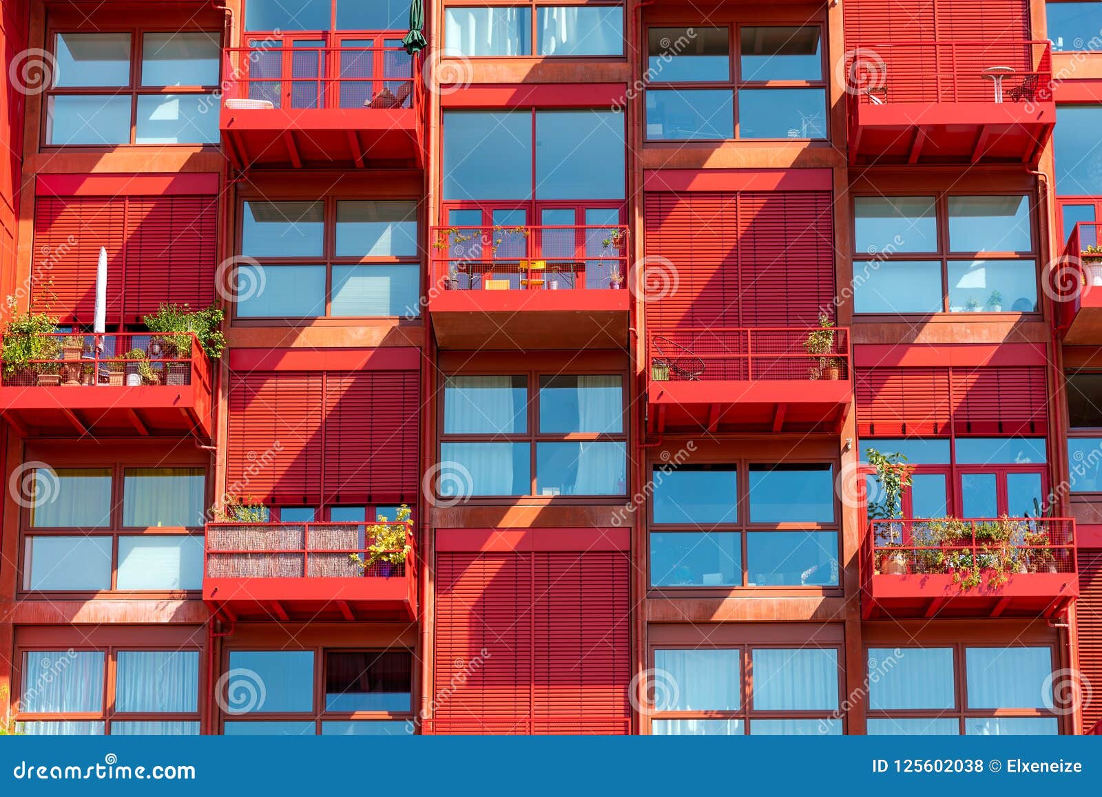 Facade of a Red Apartment House Stock Photo - Image of modern, housing ...