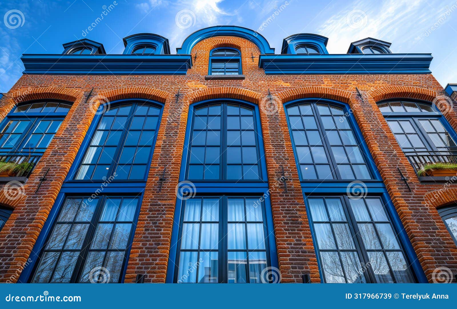 Facade of Red Brick Building with Blue Windows in the City Stock Image ...