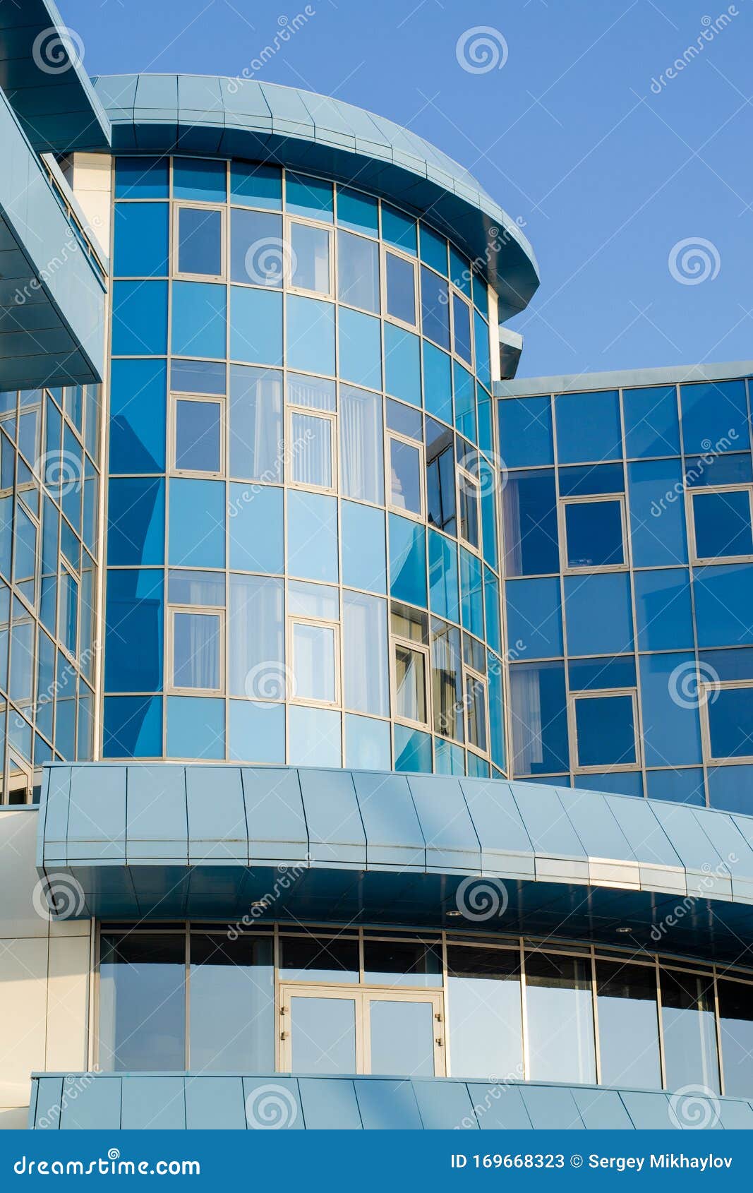 The Facade of the Round Building is Made of Blue Glass. Side View Stock ...