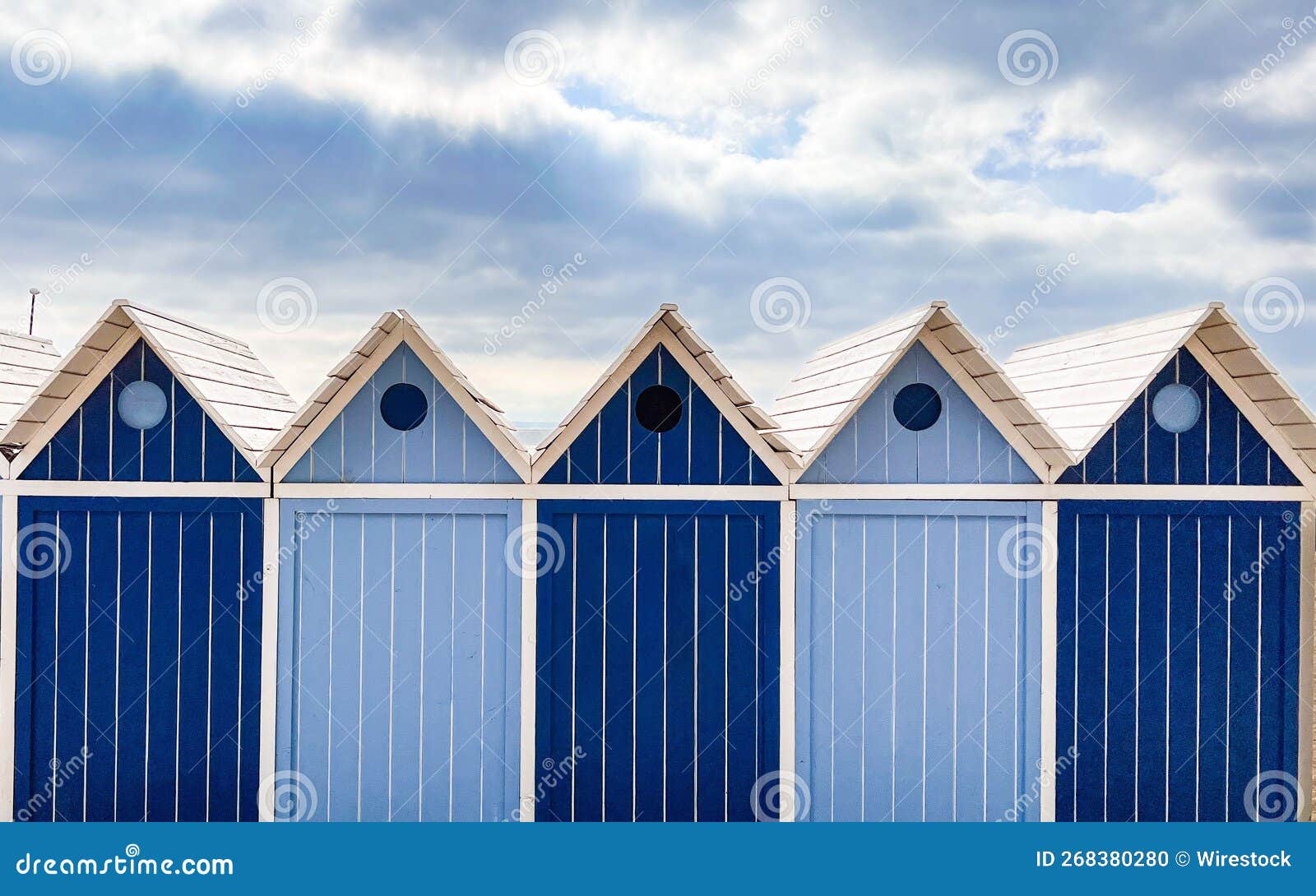Facade of a Row of Blue Cabins by the Sea Stock Photo - Image of ...