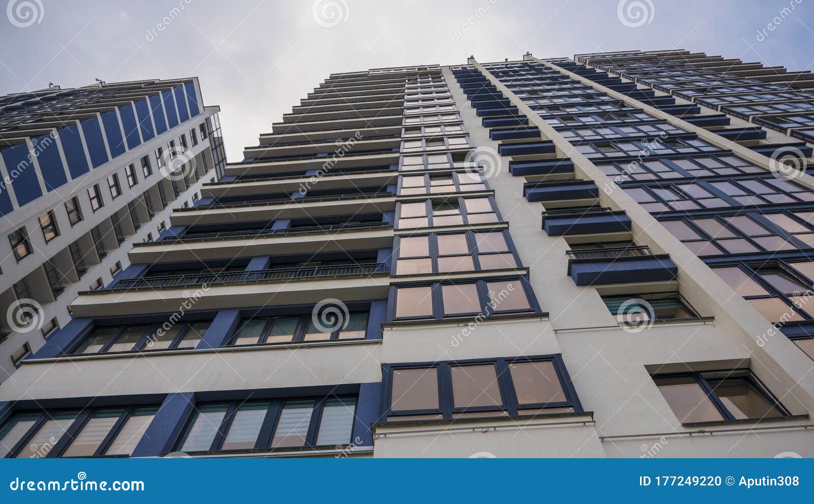 Facade of a Tall Building with Reflection in the Windows Stock Photo ...