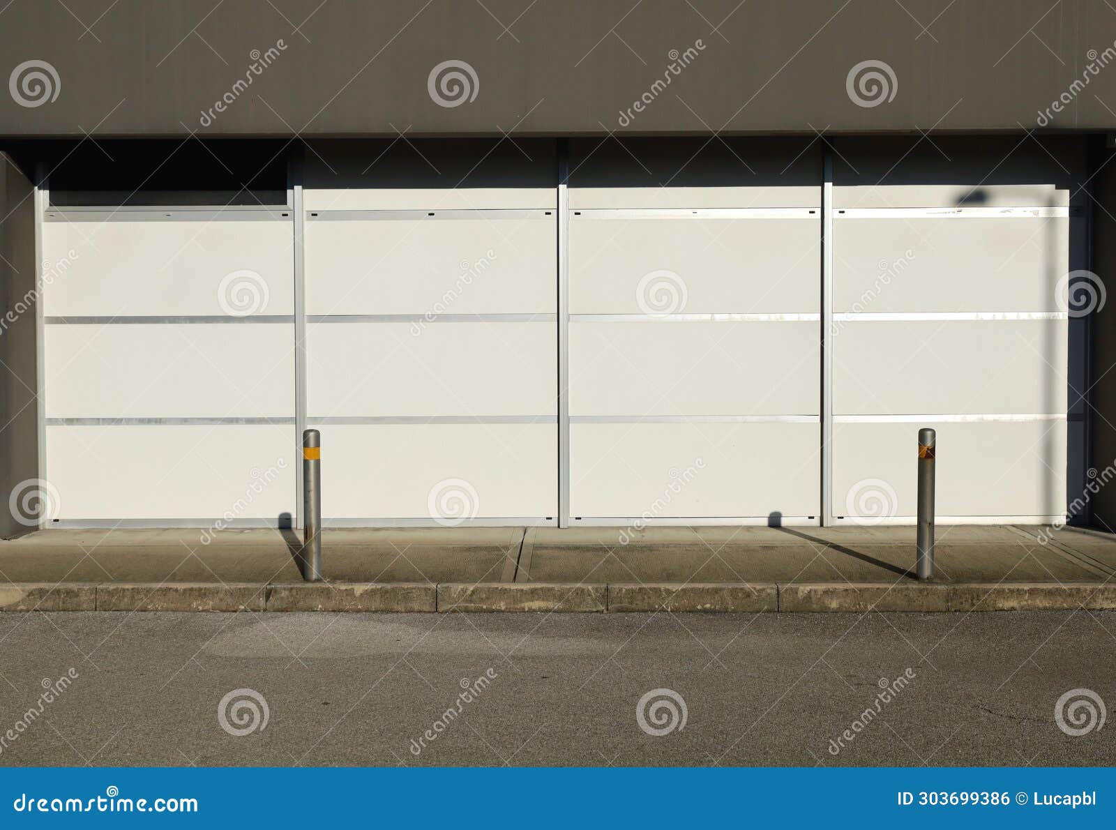 Facade with White Veiled Windows at Floor Level. Concrete Sidewalk with ...