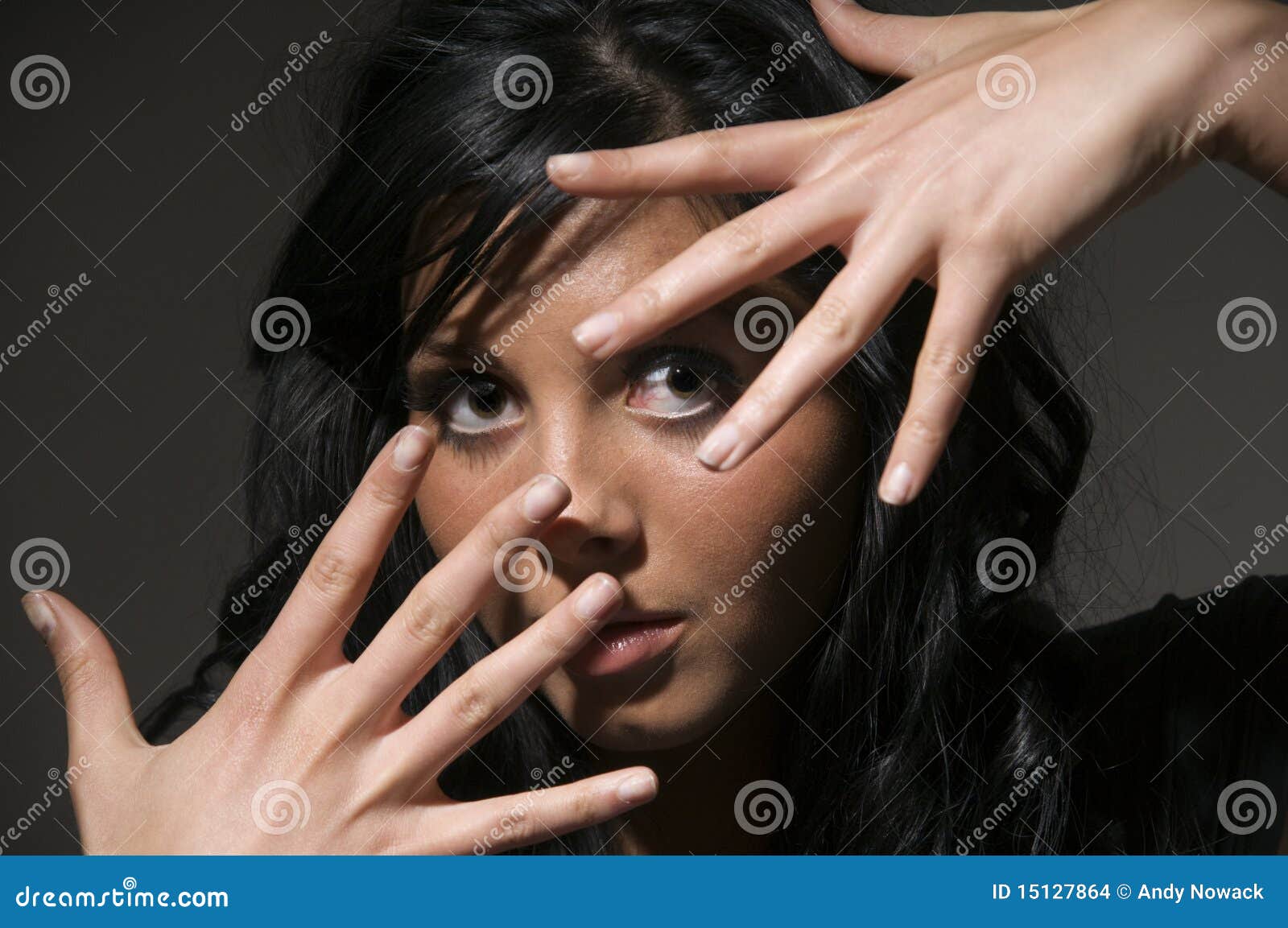 Face behind diagonal hands stock photo. Image of black - 15127864