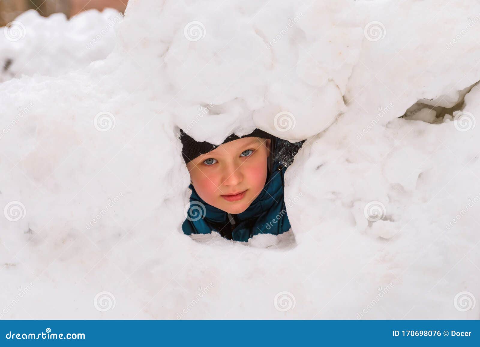 Face of a Boy Looking Out of a Snow Fortress Stock Photo - Image of ...