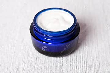 Face cream in blue jar stock image. Image of container - 27578507