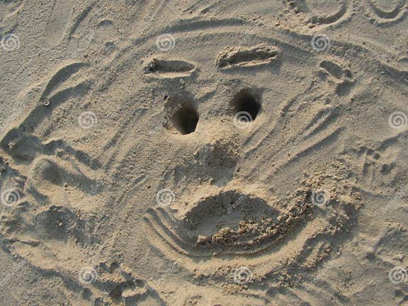 Face drawn in sand stock photo. Image of beach, sand, face - 1137658